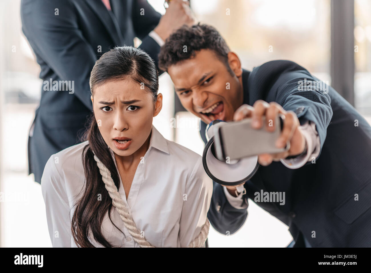 Megaphone business suits hi-res stock photography and images - Alamy
