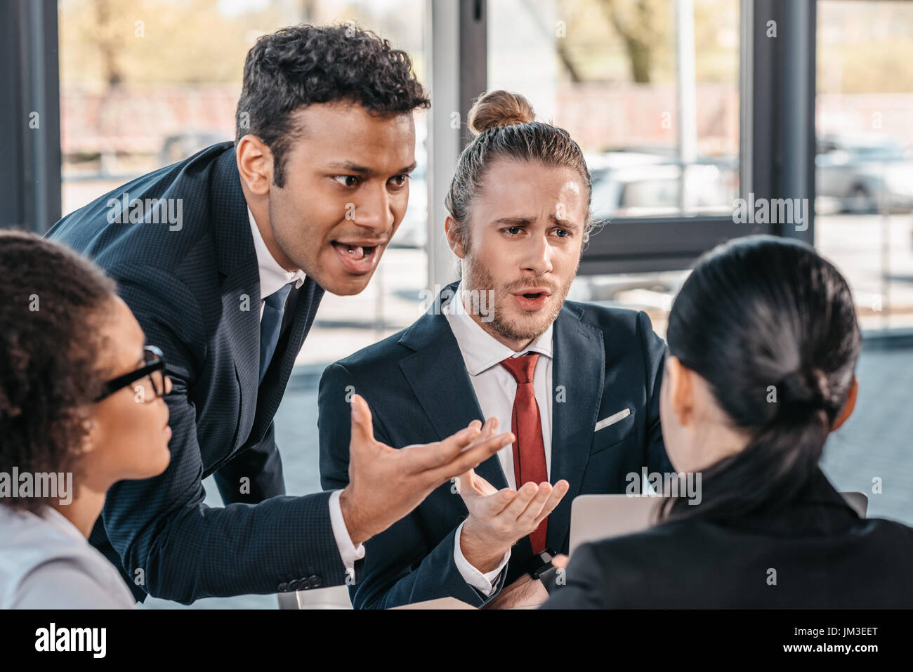 Four people arguing hi-res stock photography and images - Alamy