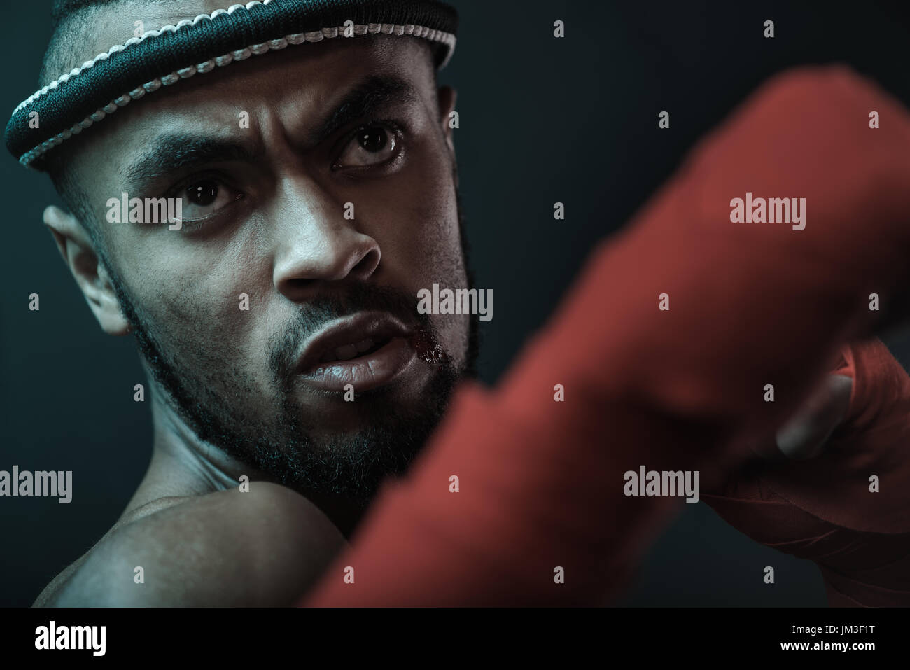 Close-up portrait of aggressive young Muay thai boxer training thai ...