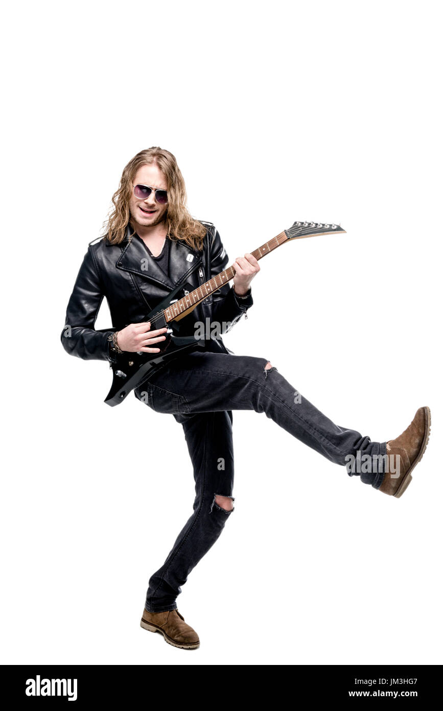 handsome rocker in sunglasses posing playing electric guitar isolated ...