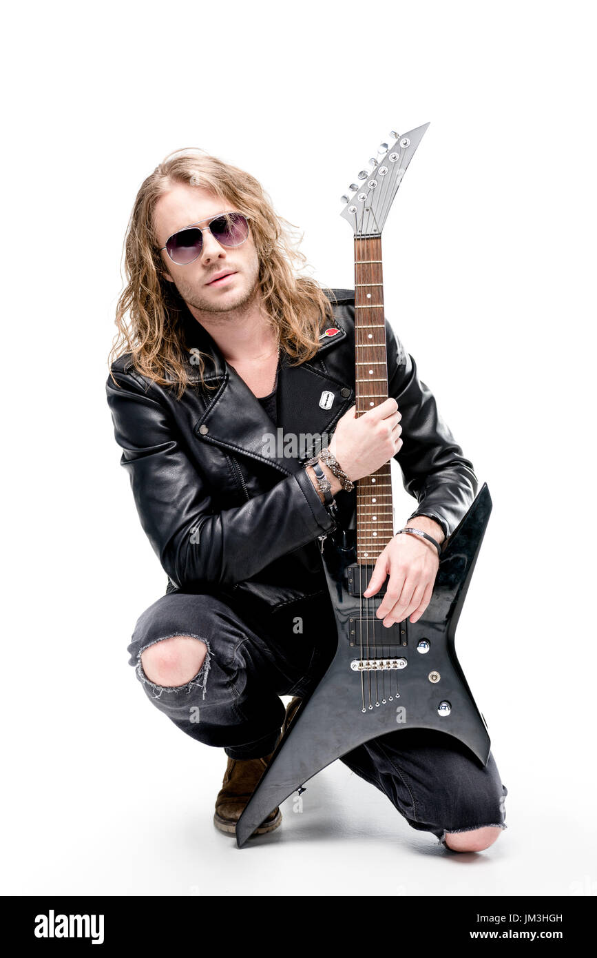 handsome rocker in sunglasses posing with electric guitar isolated on ...