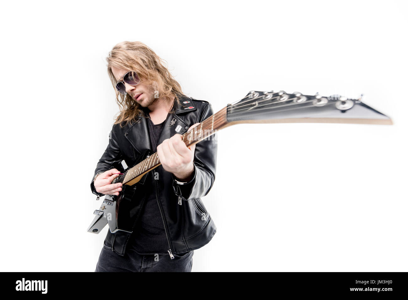 handsome rocker in sunglasses posing playing electric guitar isolated ...