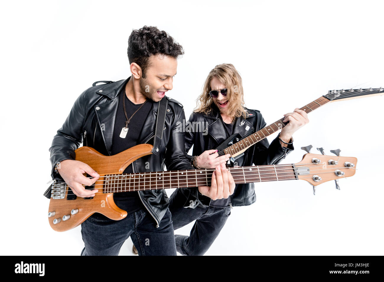 two musicians playing electric guitars isolated on white, electric ...