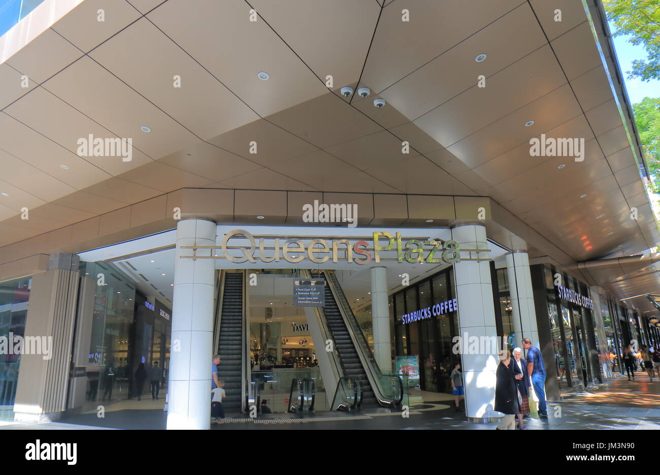 People visit Queens Plaza shopping mall on Queen Street in downtown ...