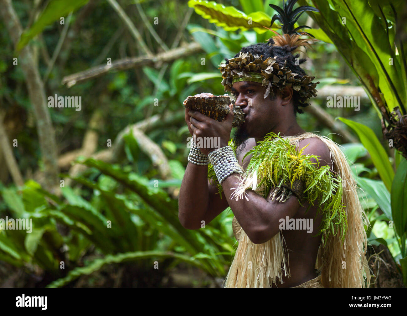 Blowing conch hi-res stock photography and images - Alamy