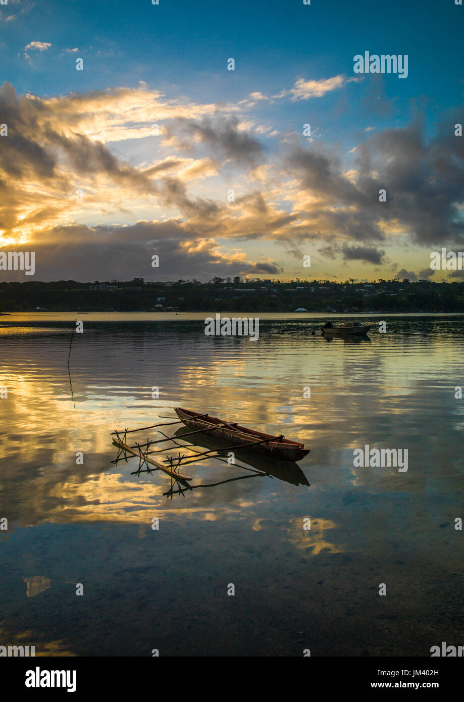 Dugout boat on a quiet sea in Erakor beach, Shefa Province, Efate ...