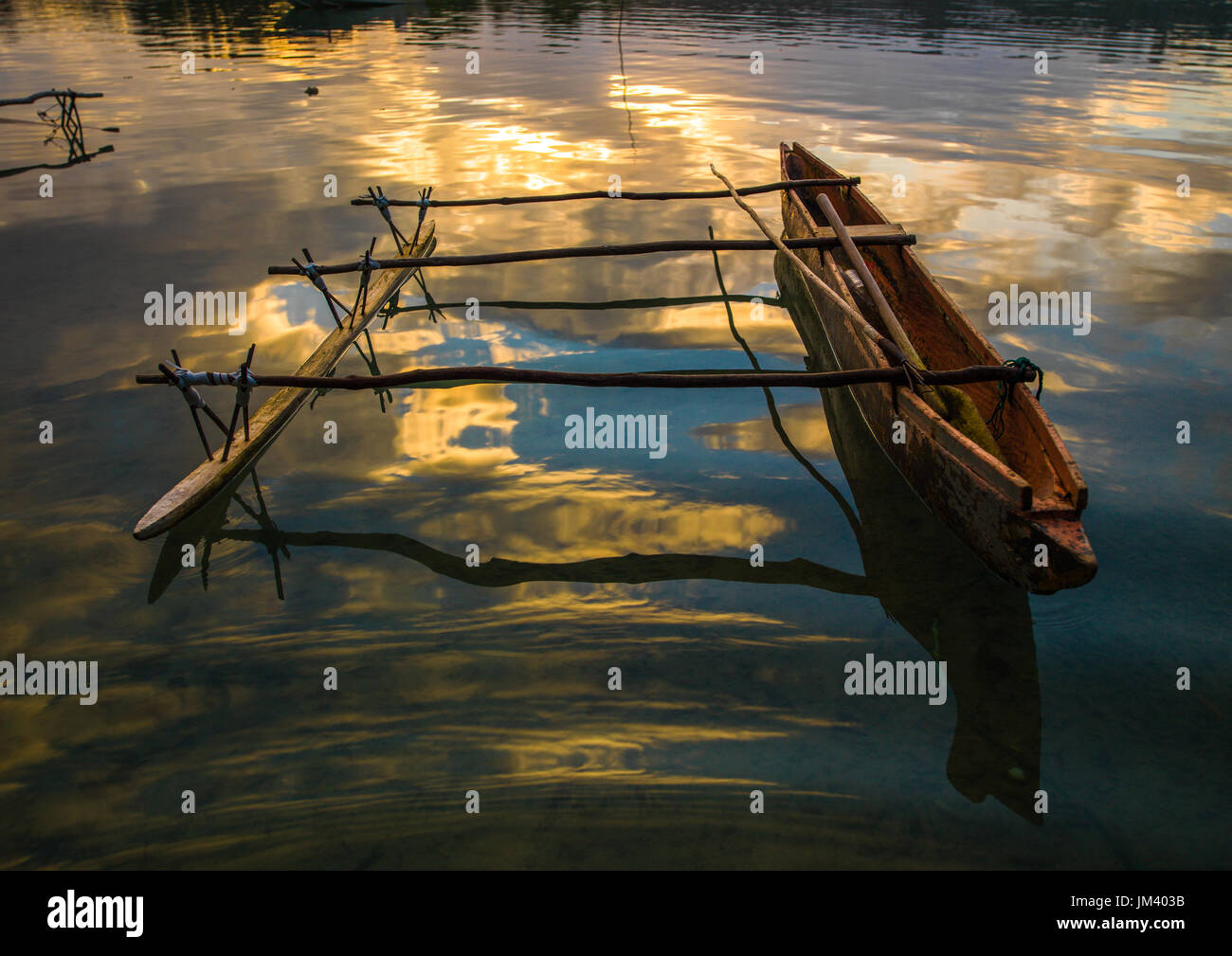 Dugout boat on a quiet sea in Erakor beach, Shefa Province, Efate ...