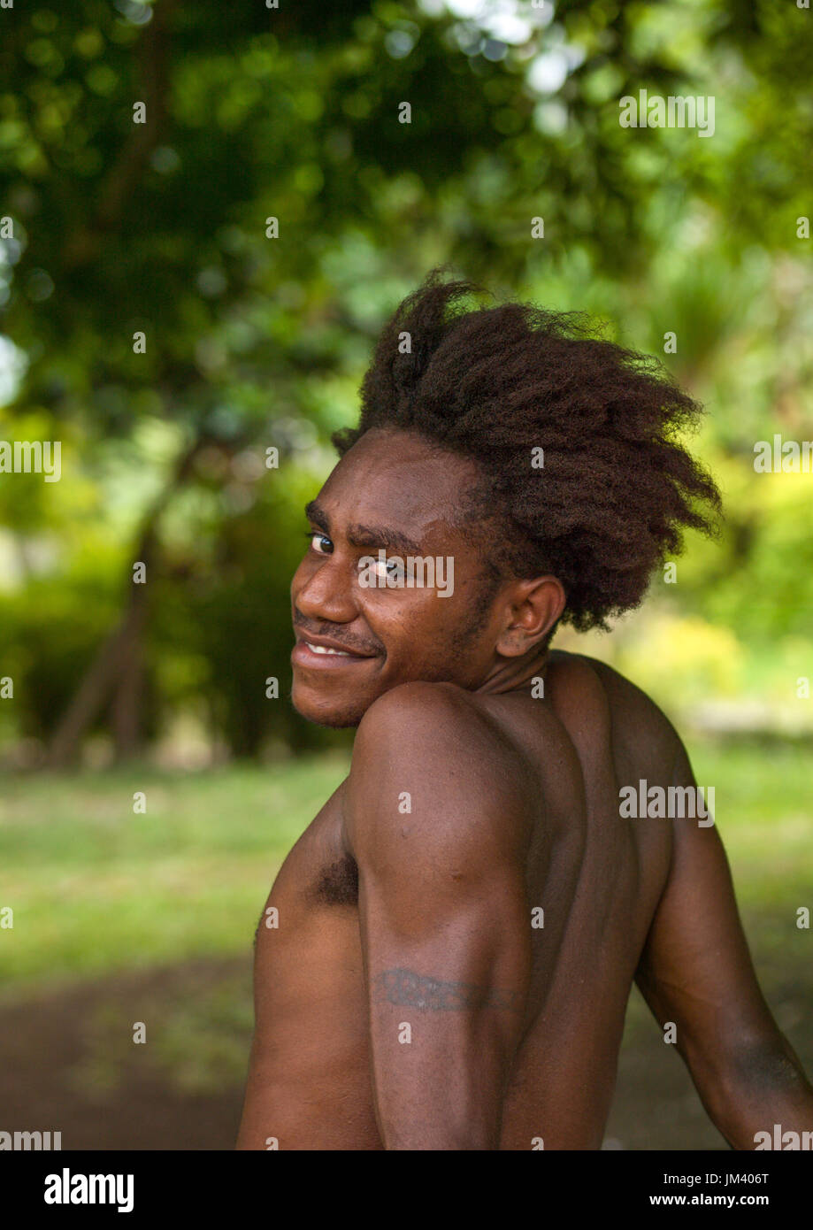 Portrait of a Ni-Vanuatu young man with tattoos on the arms, Malampa ...