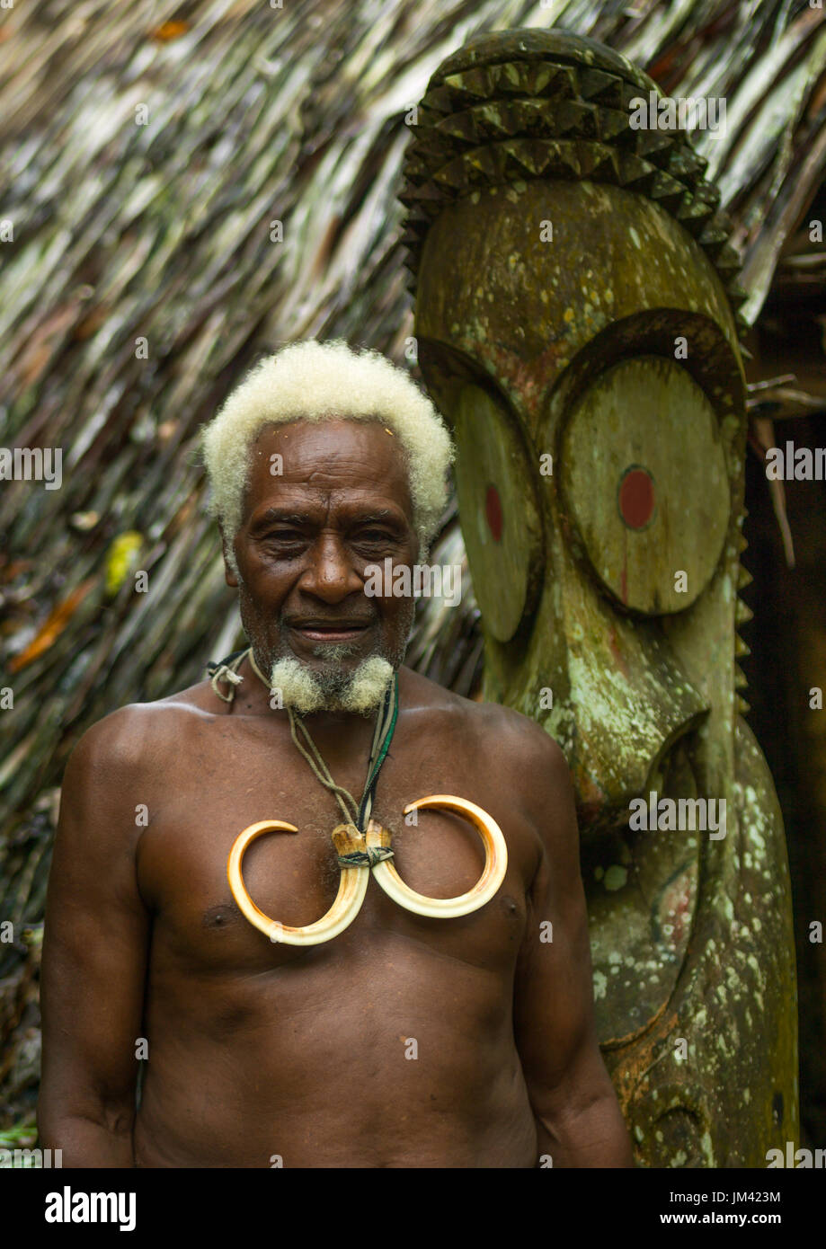 Portrait of chieftain Jean-Denis with a necklace of wild pig tusks ...