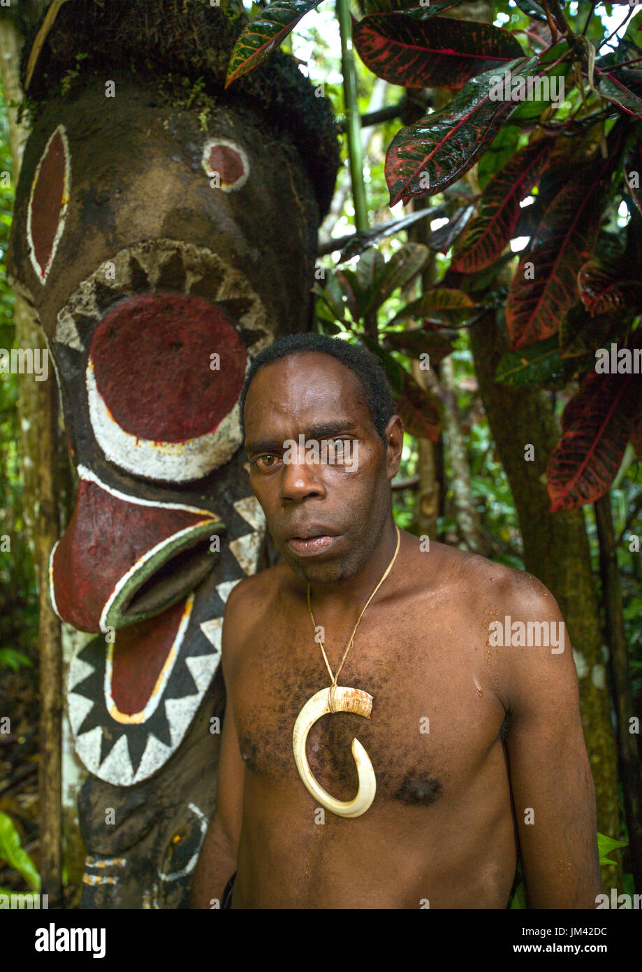 Portrait of chieftain Sekor in front of a painted grade statue, Ambrym ...