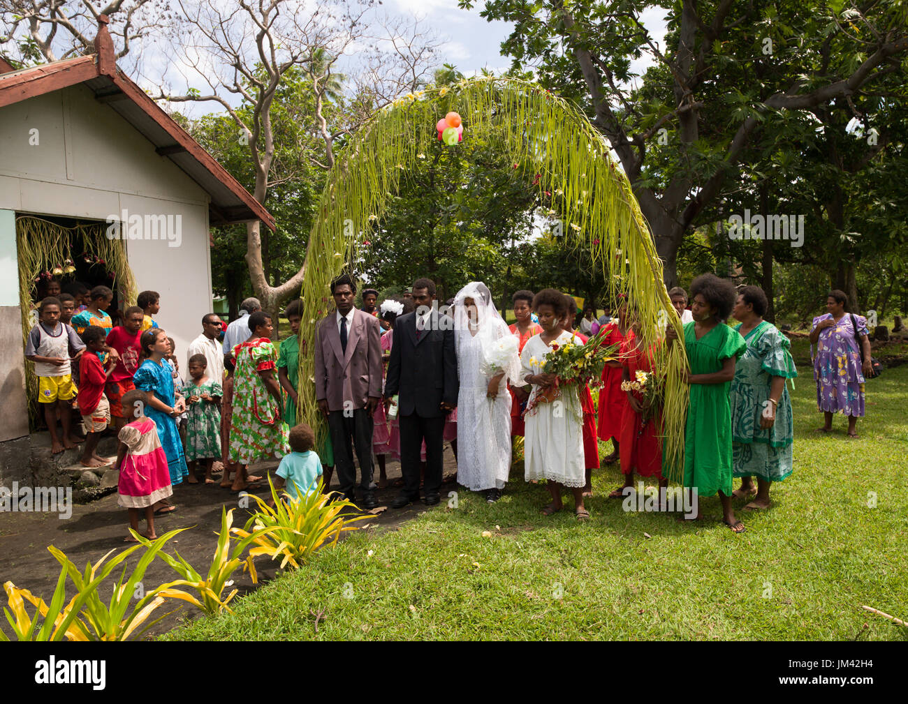 Bride and groom entering the church during a traditional wedding ...