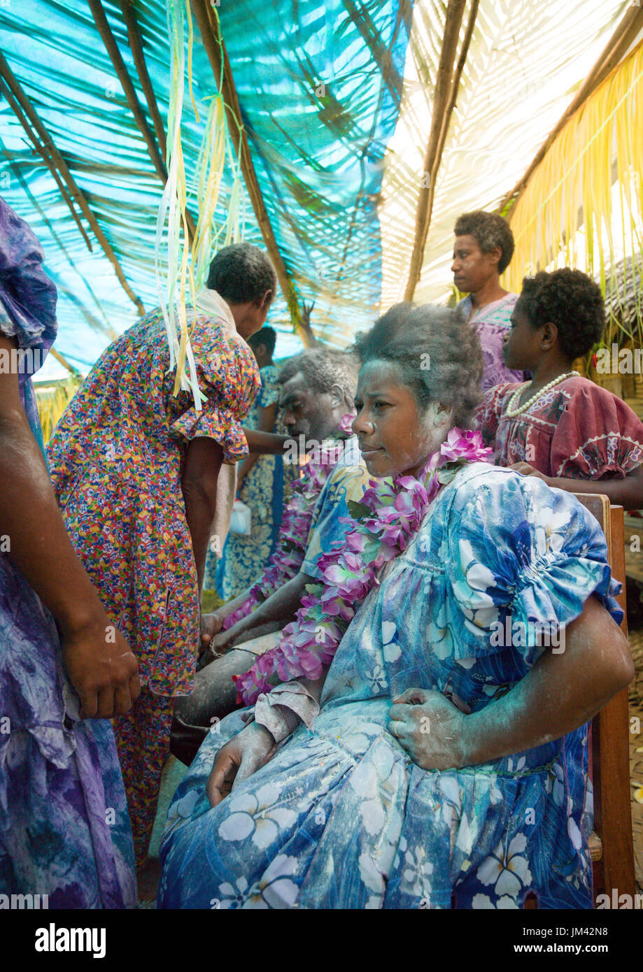 Couple covered in flour during a traditional wedding, Malampa Province ...