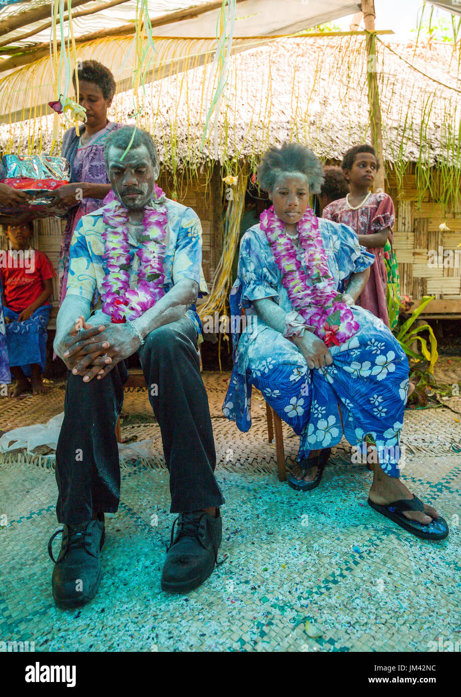Couple covered in flour during a traditional wedding, Malampa Province ...
