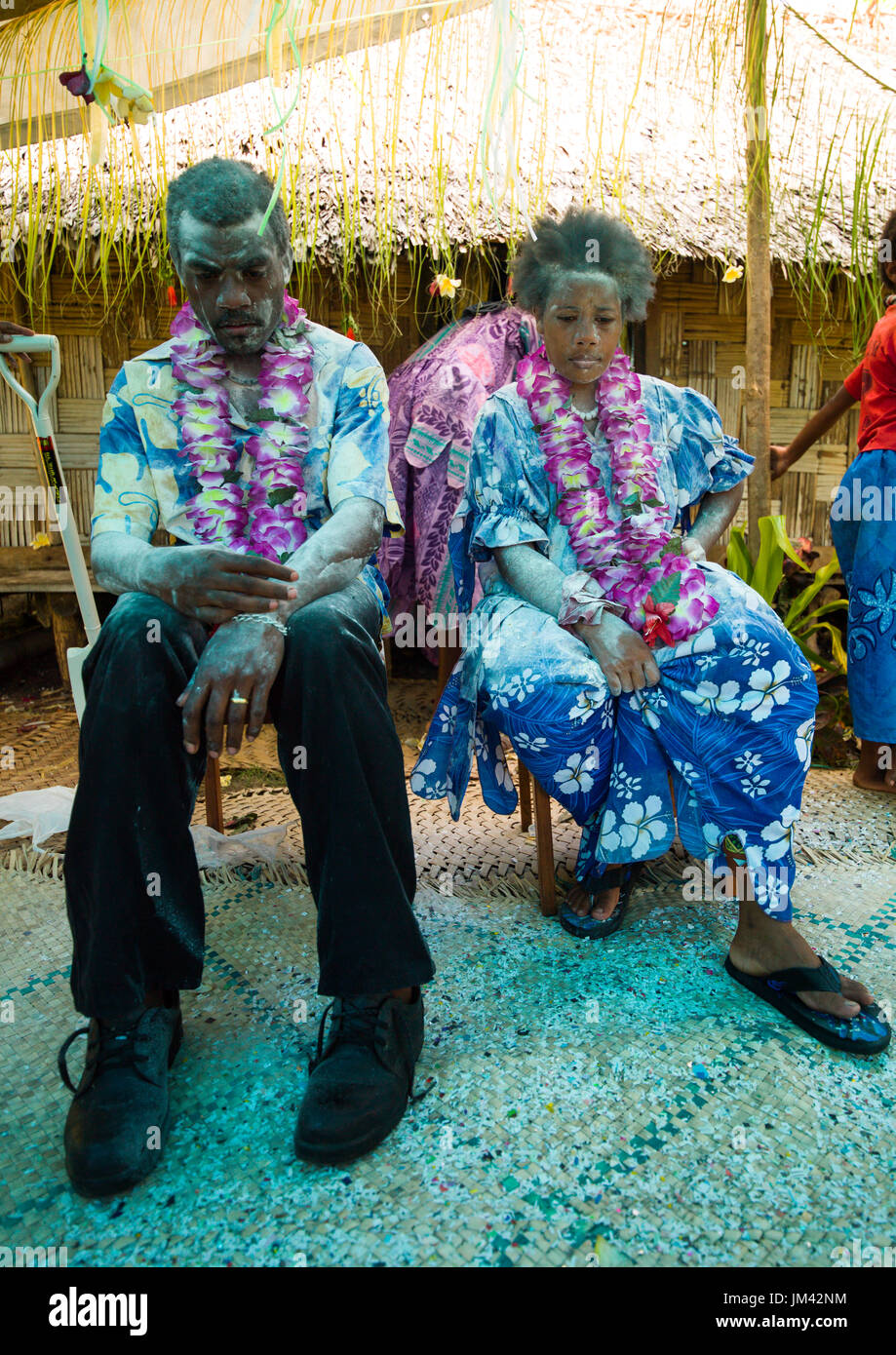 Couple covered in flour during a traditional wedding, Malampa Province ...