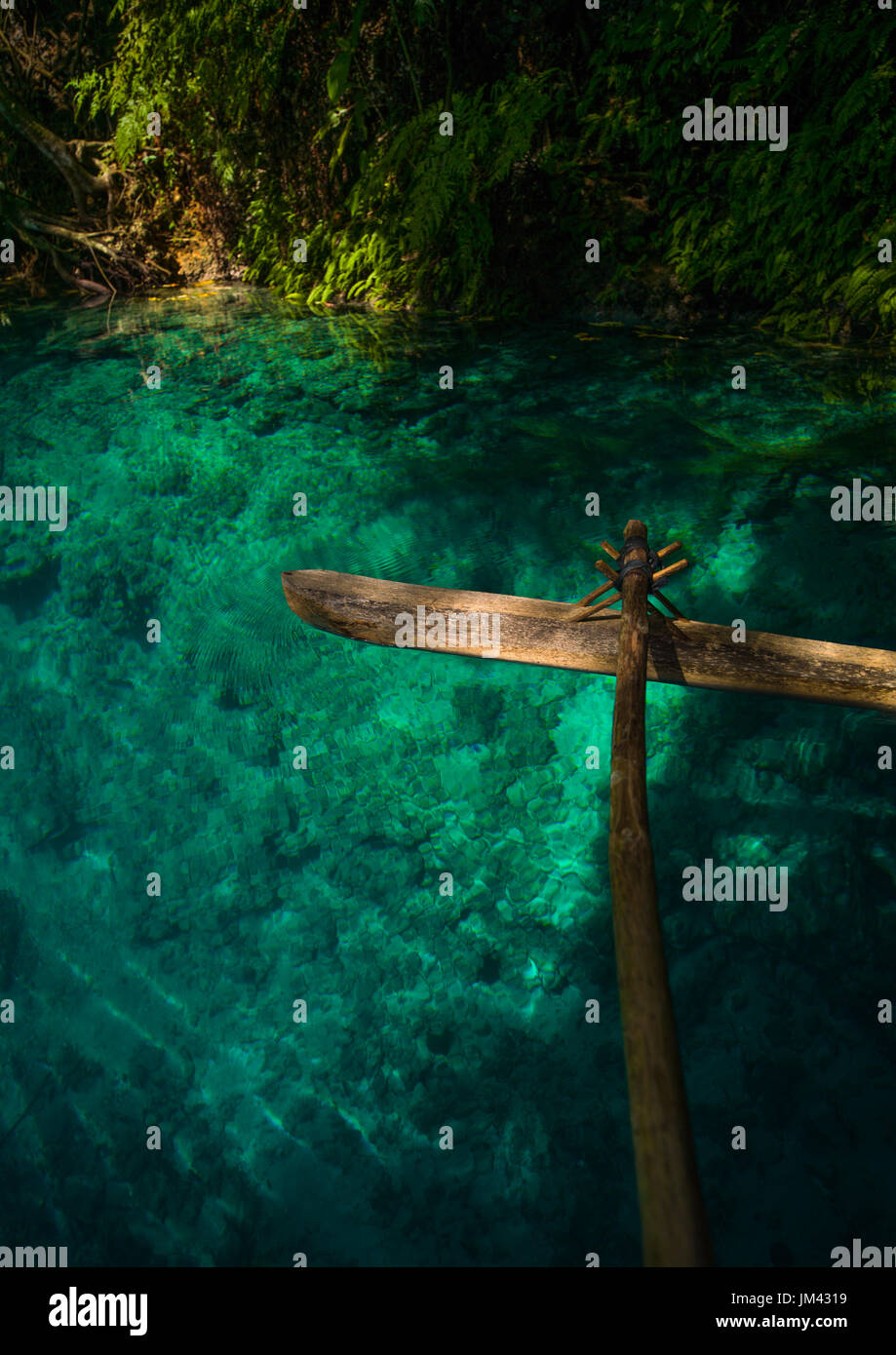 Dugout boat on a green water river, Sanma Province, Espiritu Santo ...