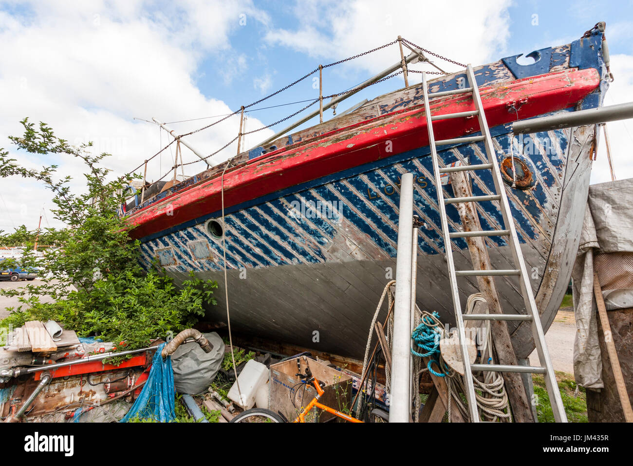 Bow view of dry docked former lifeboat with peeling paint much ...