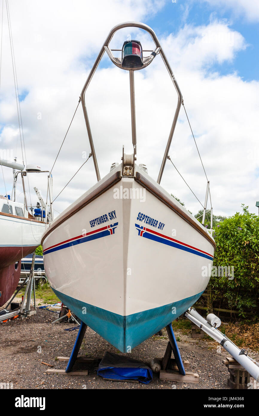 Wide angle view of small yacht dry docked in boatyard Stock Photo - Alamy