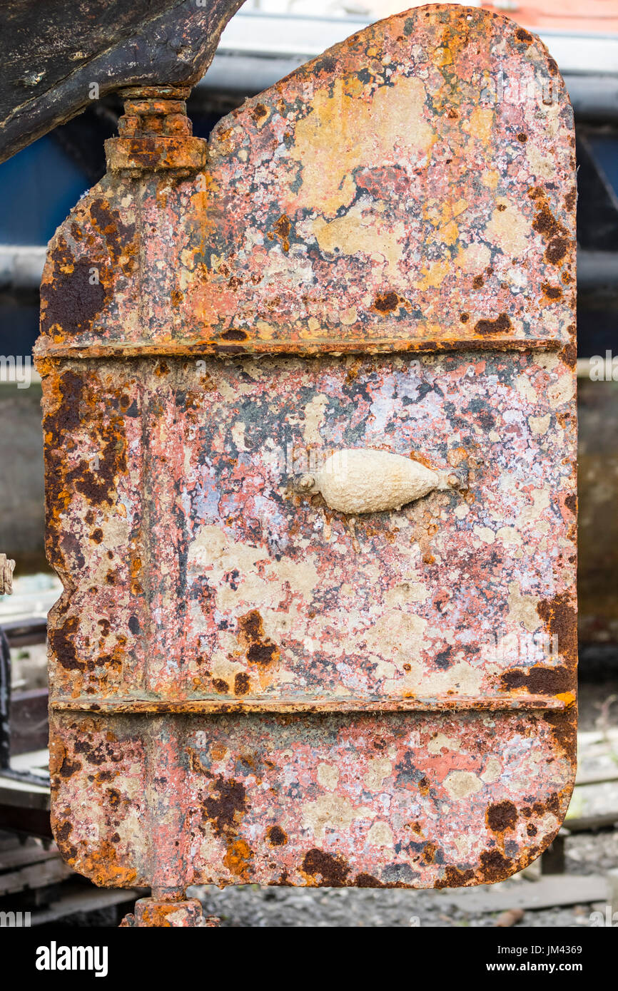Very rusted rudder of dry docked boat. Heavily textured and encrusted ...