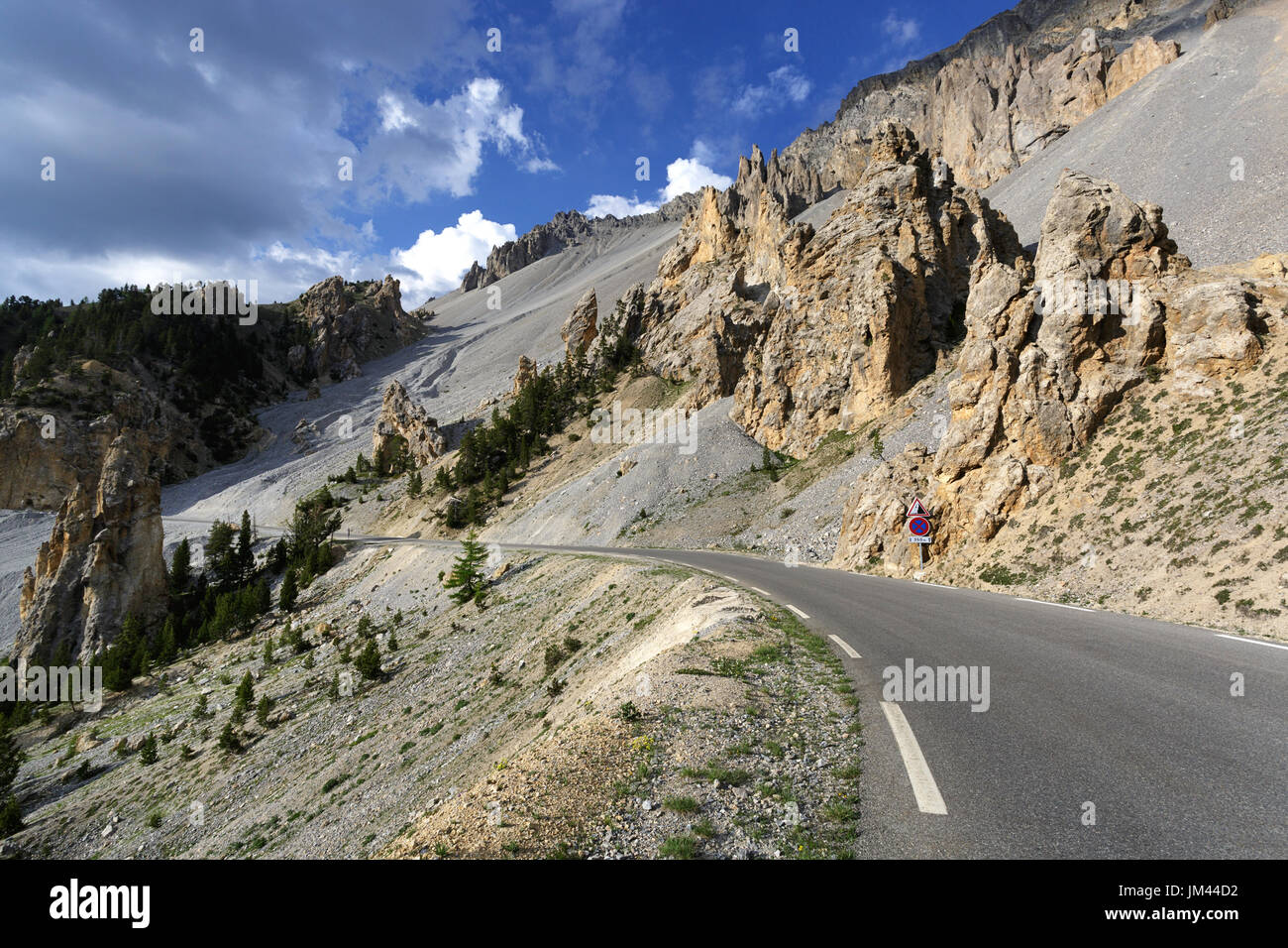 Mountain road in lunar landscape at Casse Deserte, Col d'Izoard, France ...