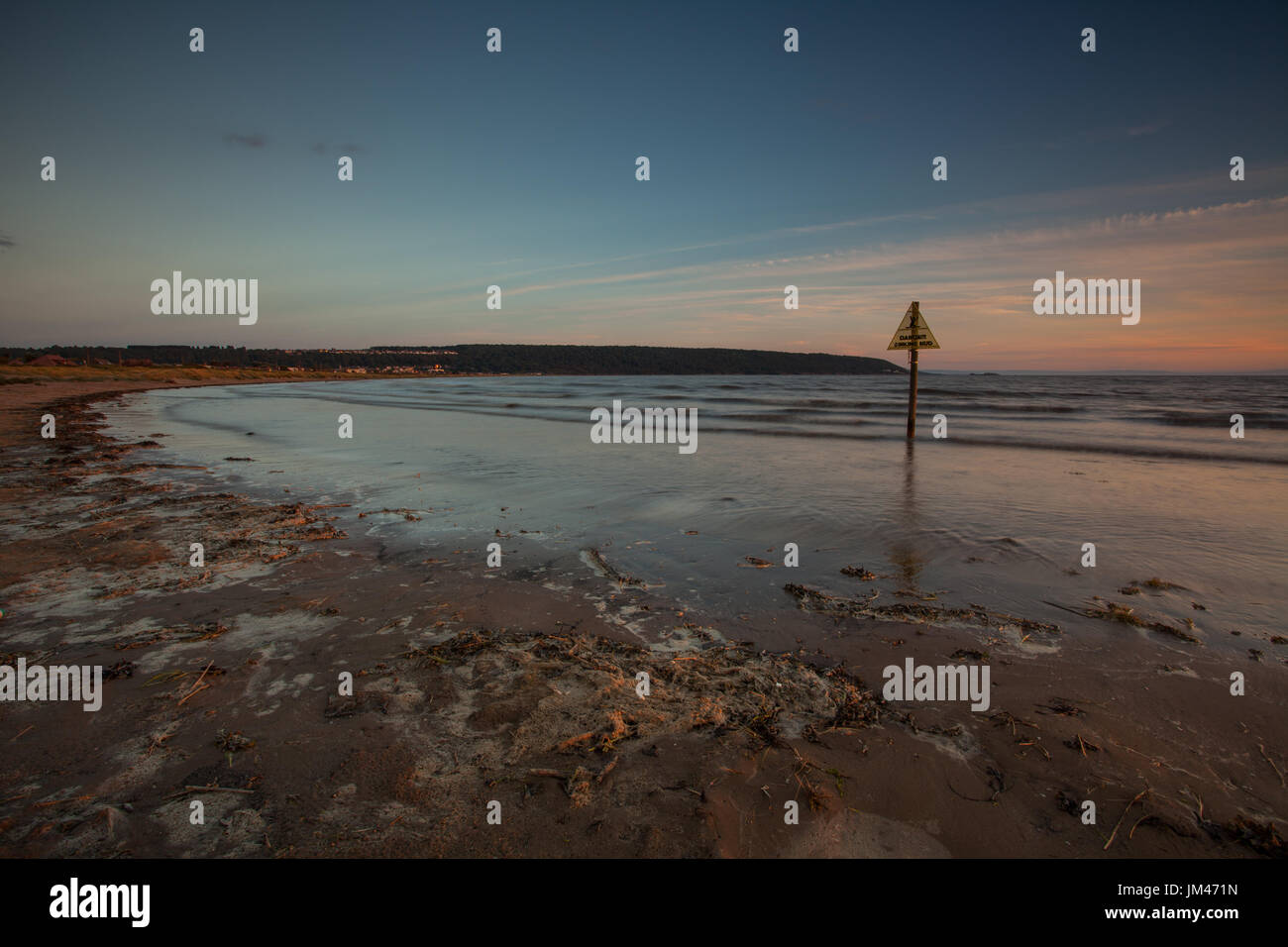 Sunset beach scene Stock Photo - Alamy