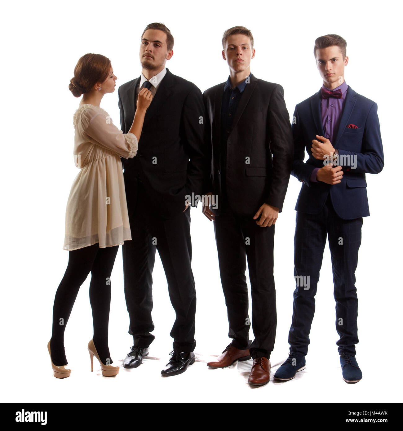 A group of well-dressed people standing on white background Stock Photo ...