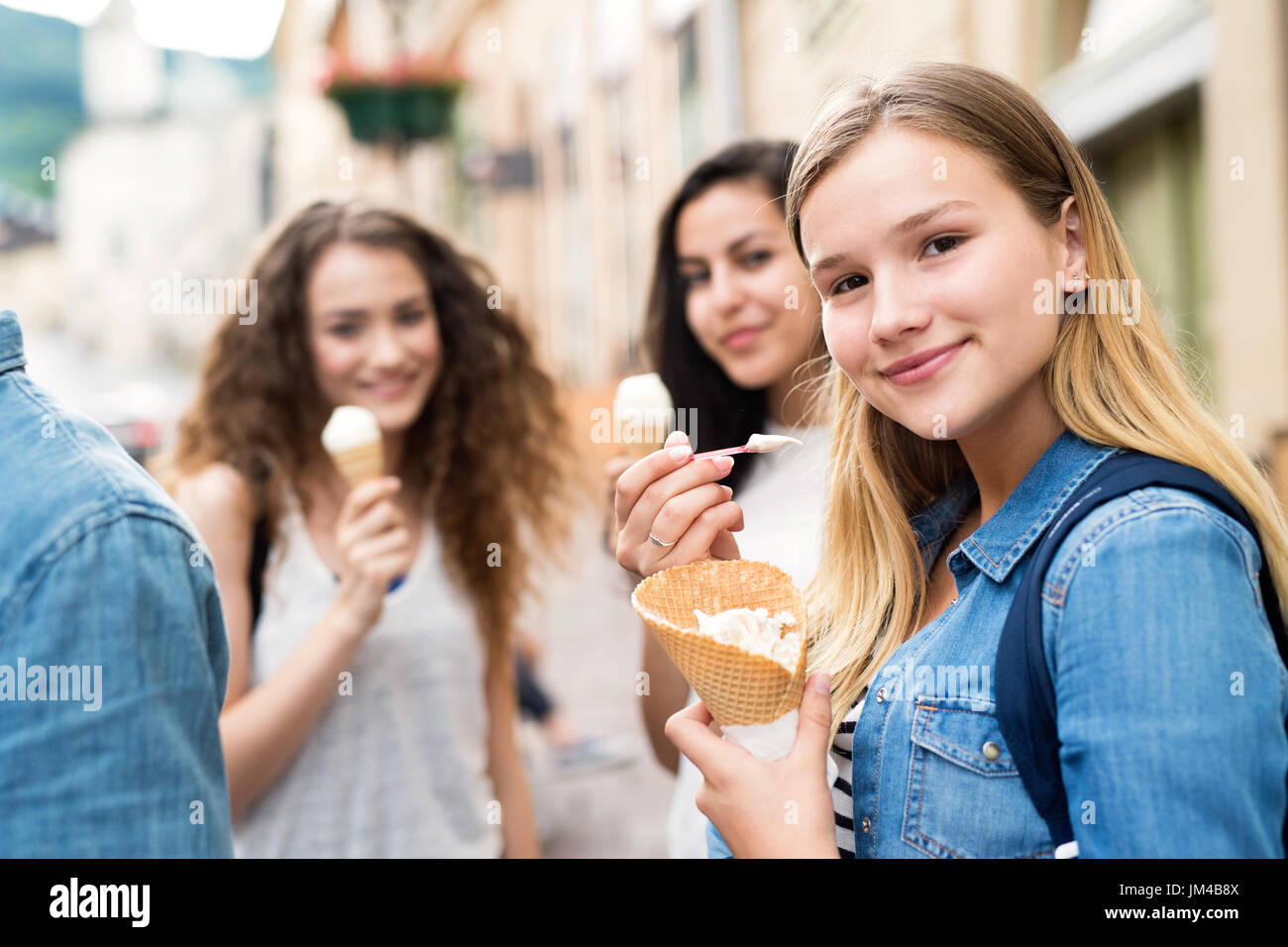 Group of attractive teenage students in town eating ice cream Stock ...