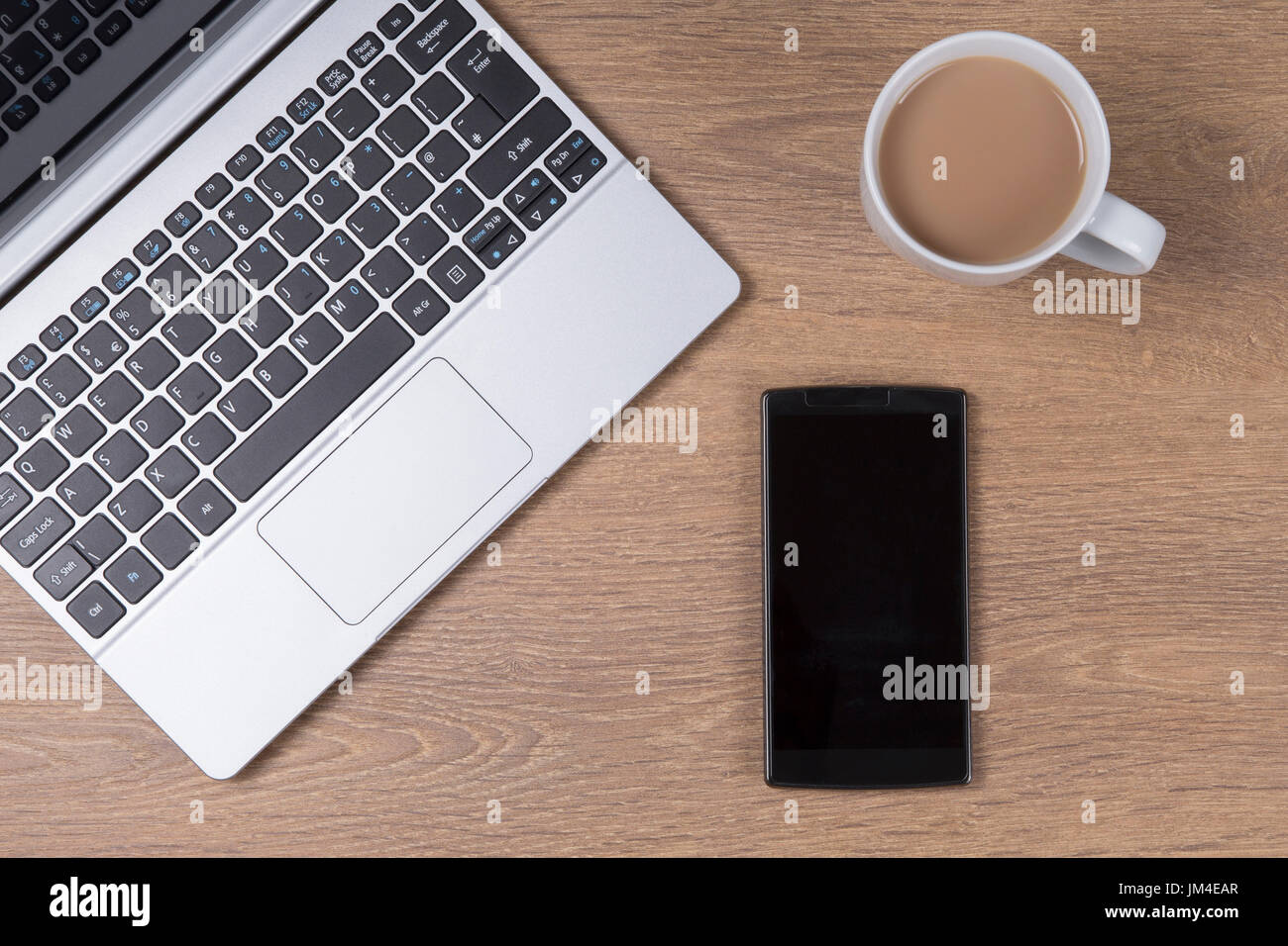 Open laptop with a tea cup hi-res stock photography and images - Alamy