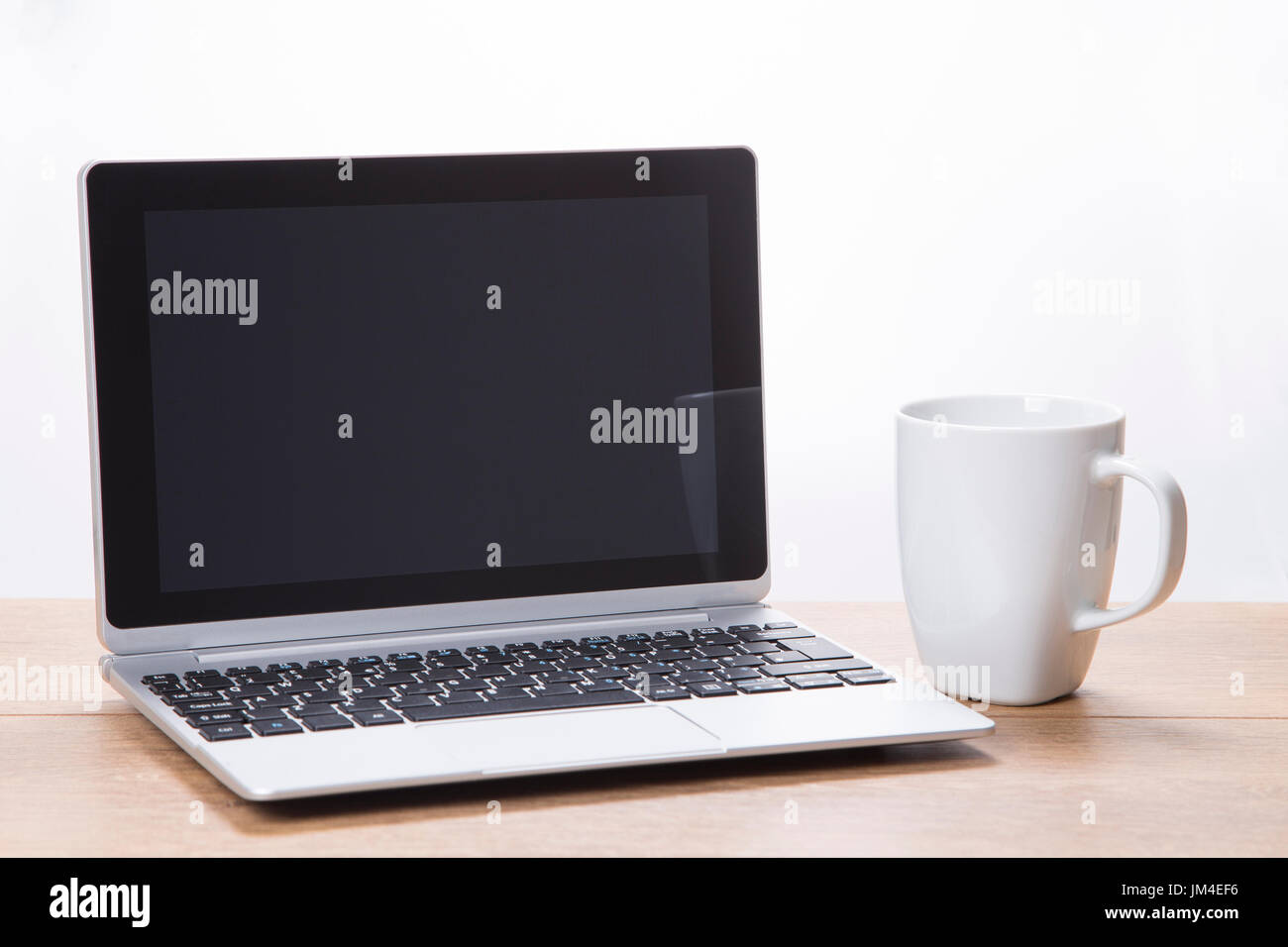 Laptop open next to them hi-res stock photography and images - Alamy