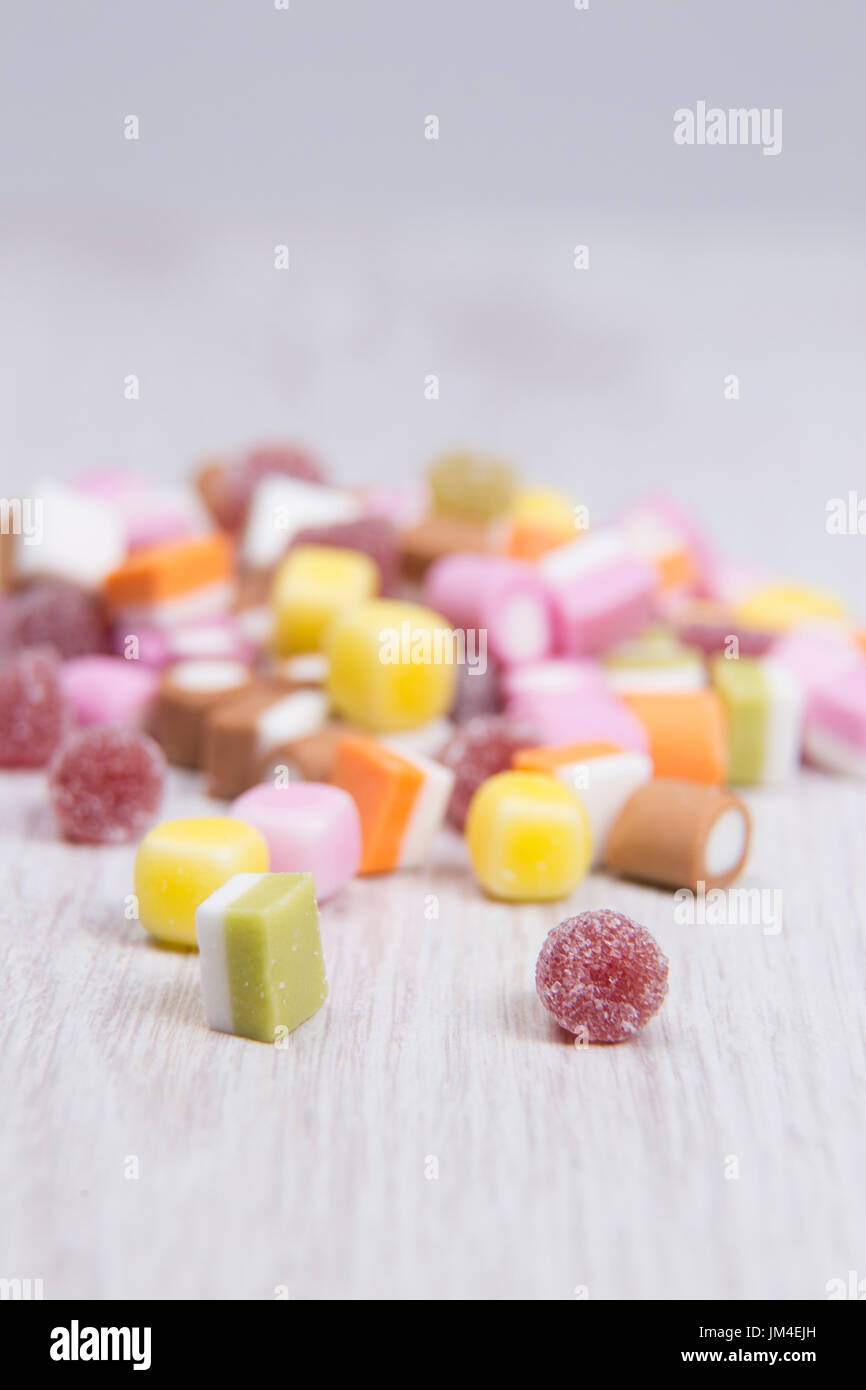 Sweets laid on a white table with copy space Stock Photo - Alamy