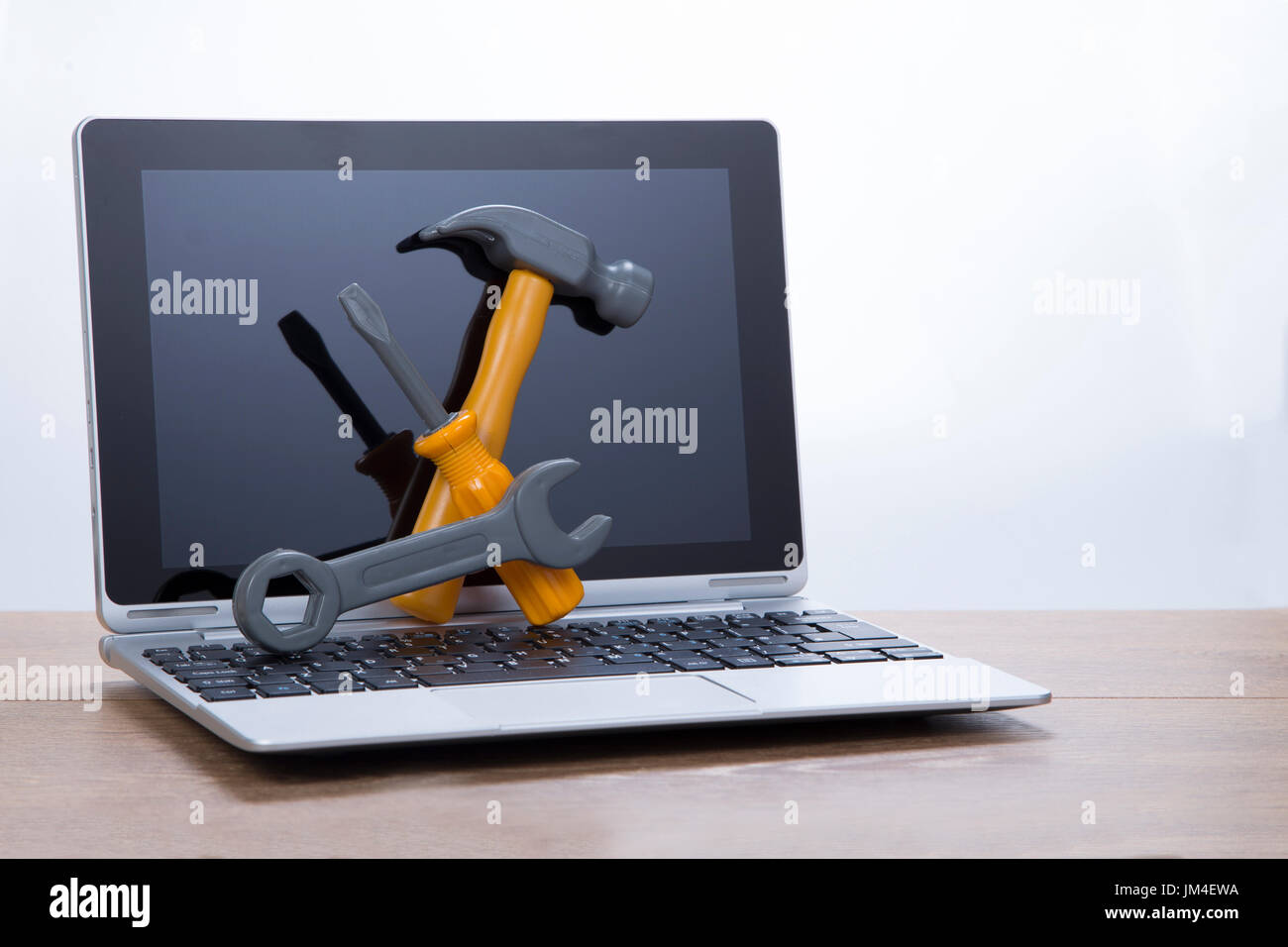 Laptop repair and maintenance concept with a modern open computer with ...