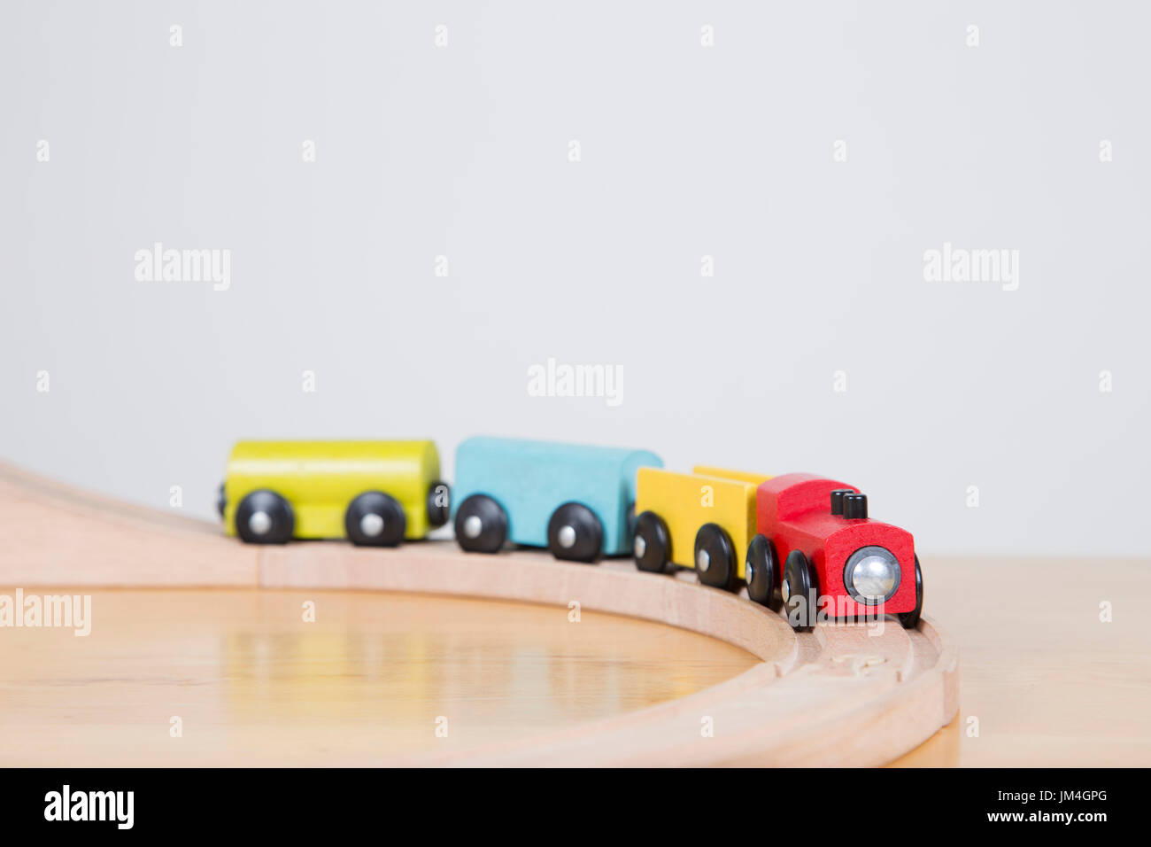 Toy train on a table top - journey concept Stock Photo - Alamy