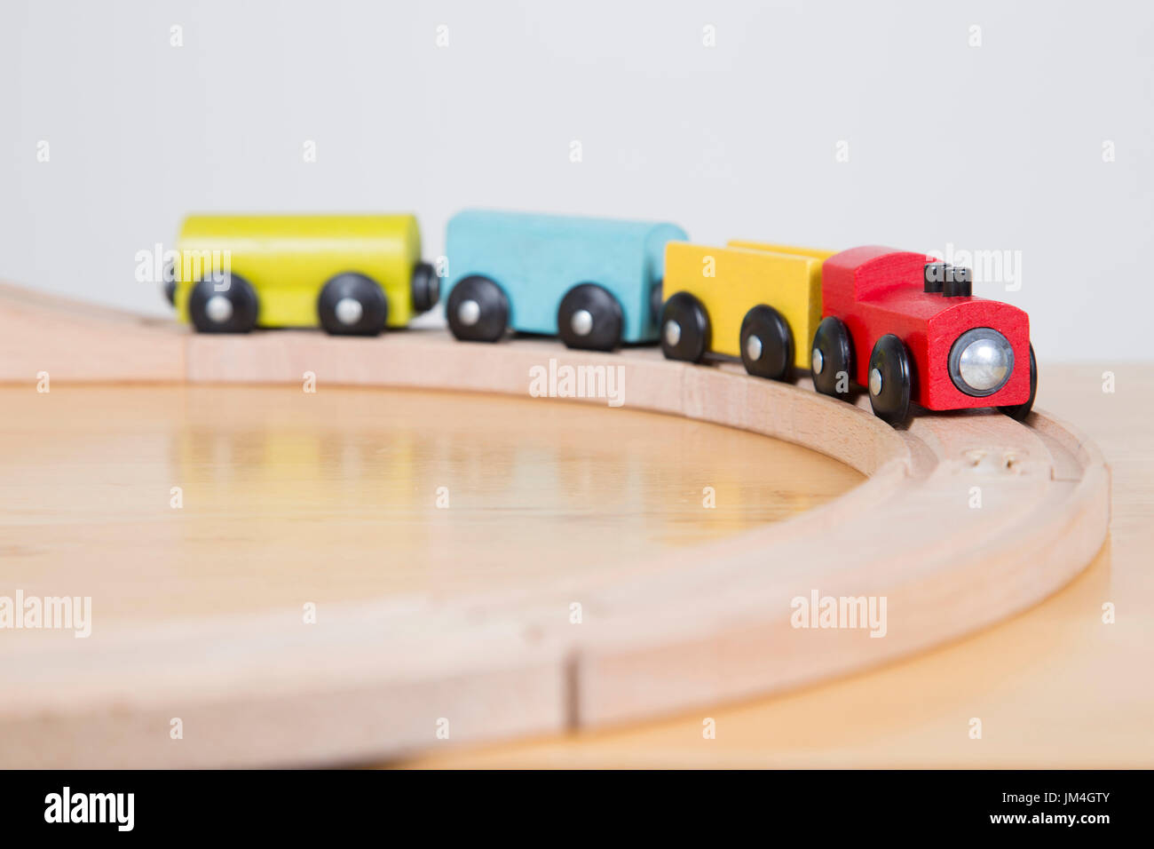 Toy train heading towards the camera - journey concept Stock Photo - Alamy