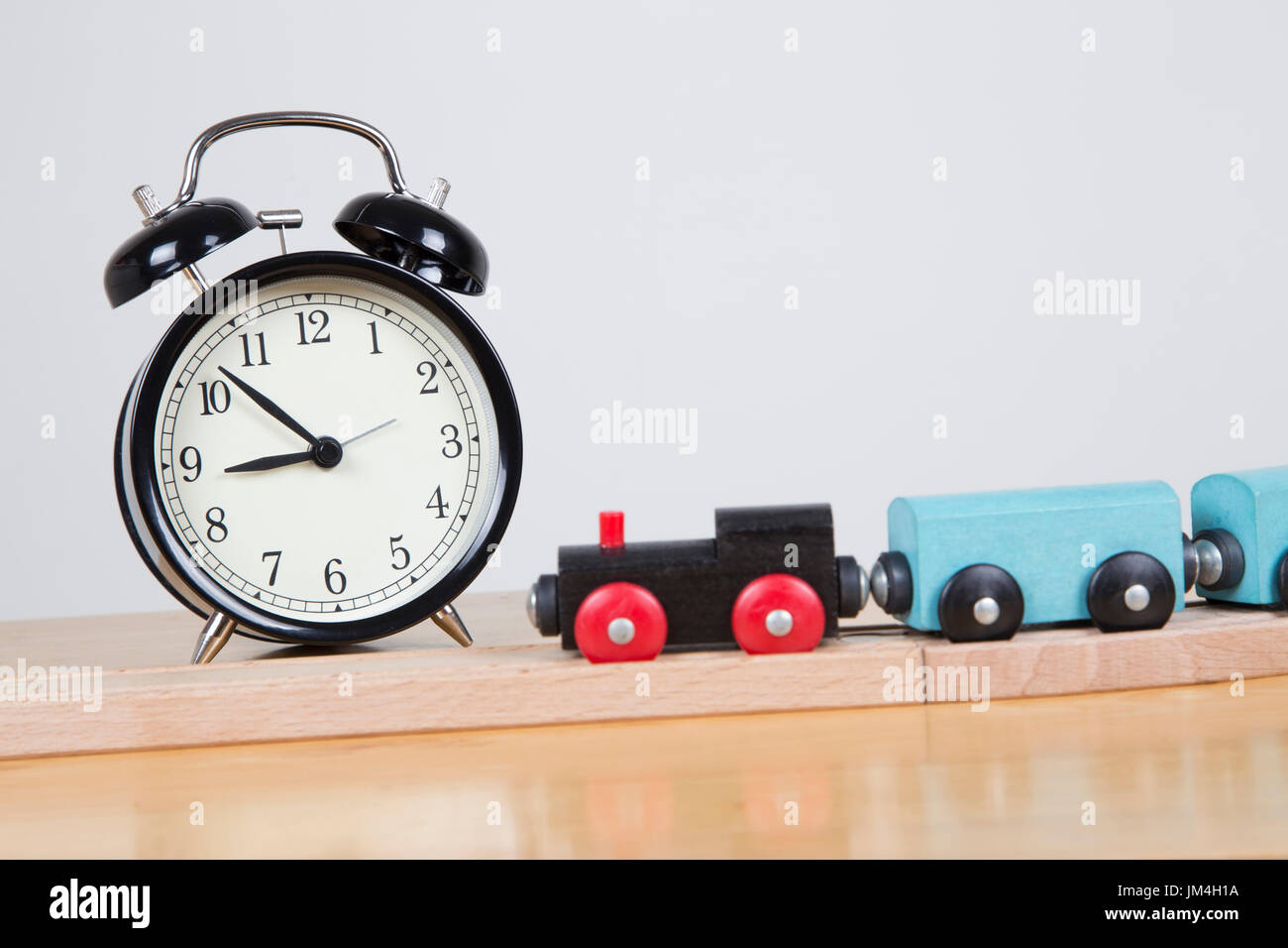Train rushing past a clock - time concept Stock Photo - Alamy