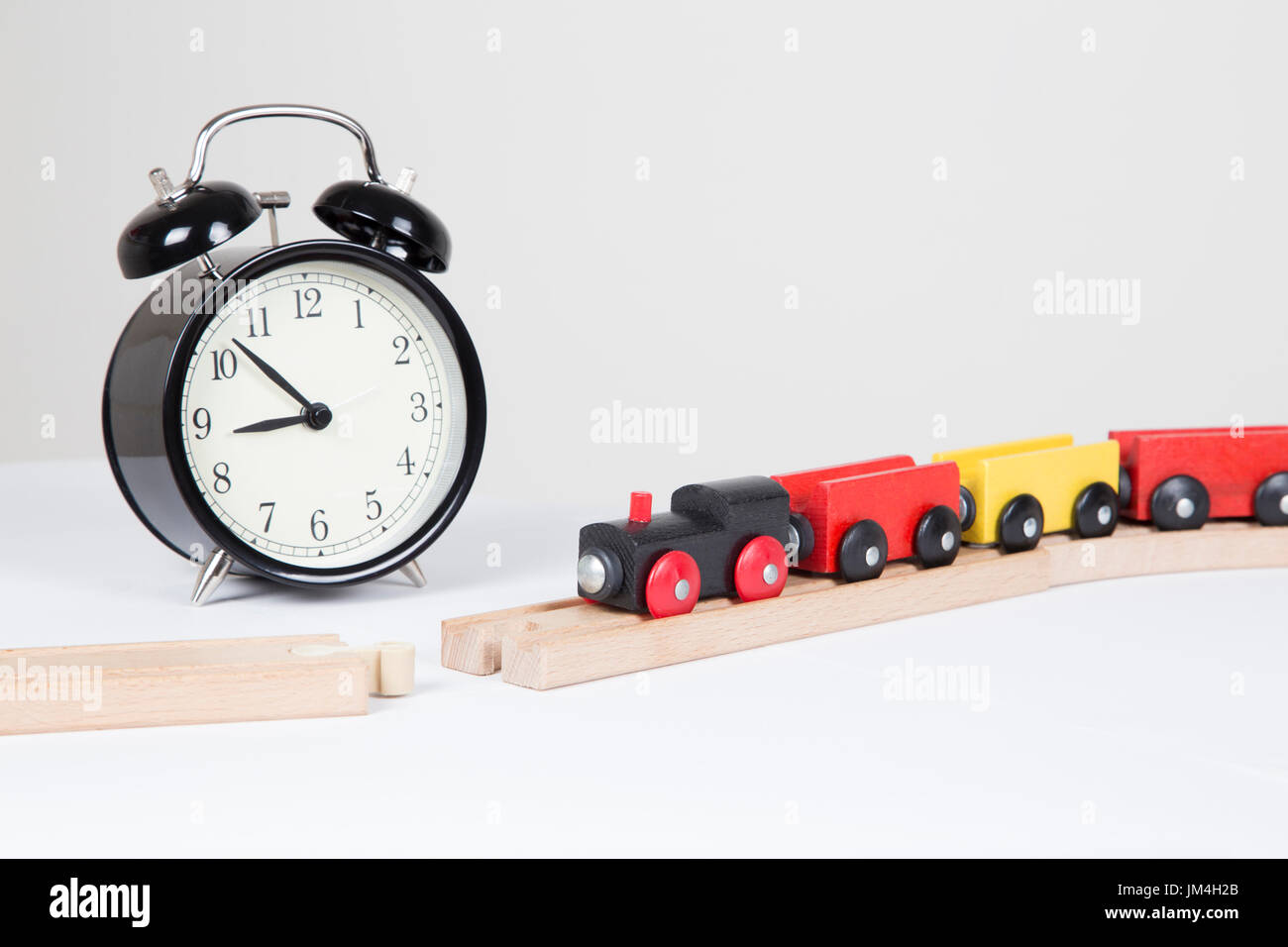 Wooden train set on a broken track Stock Photo - Alamy