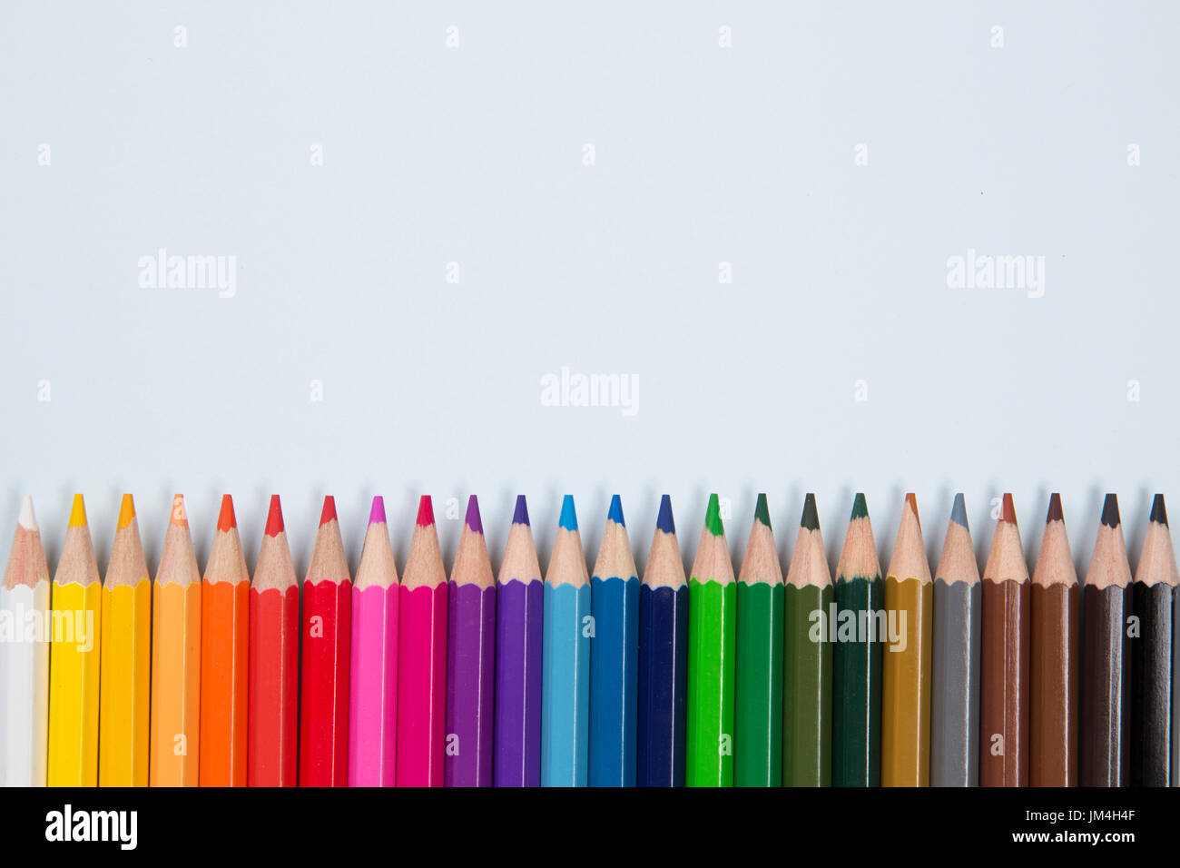 Colouring pencils in a row with space for text Stock Photo - Alamy