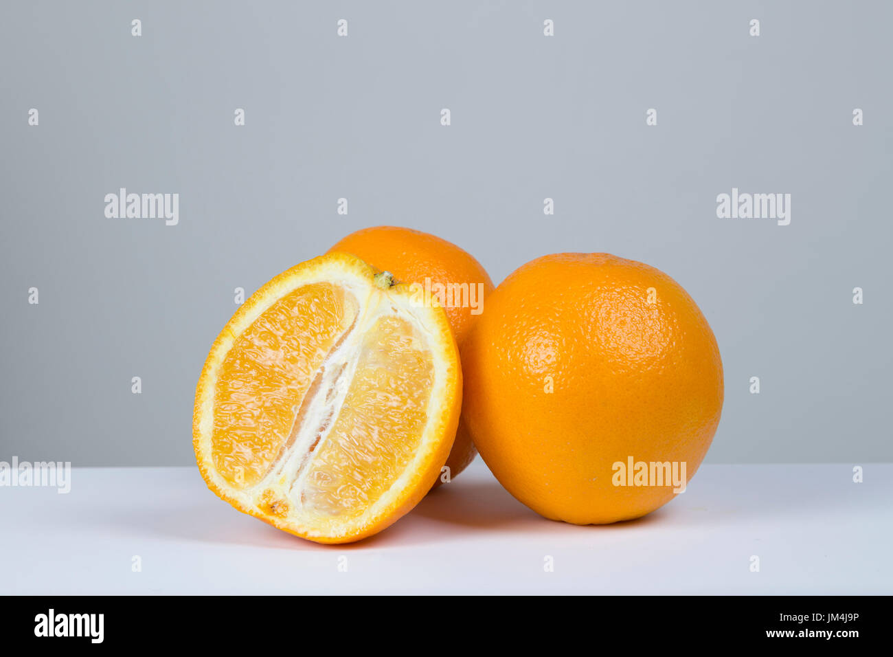 Orange sliced in half Stock Photo - Alamy