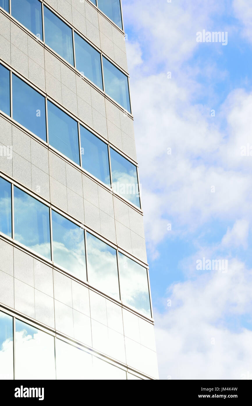 Tall office building in blue sky background Stock Photo - Alamy