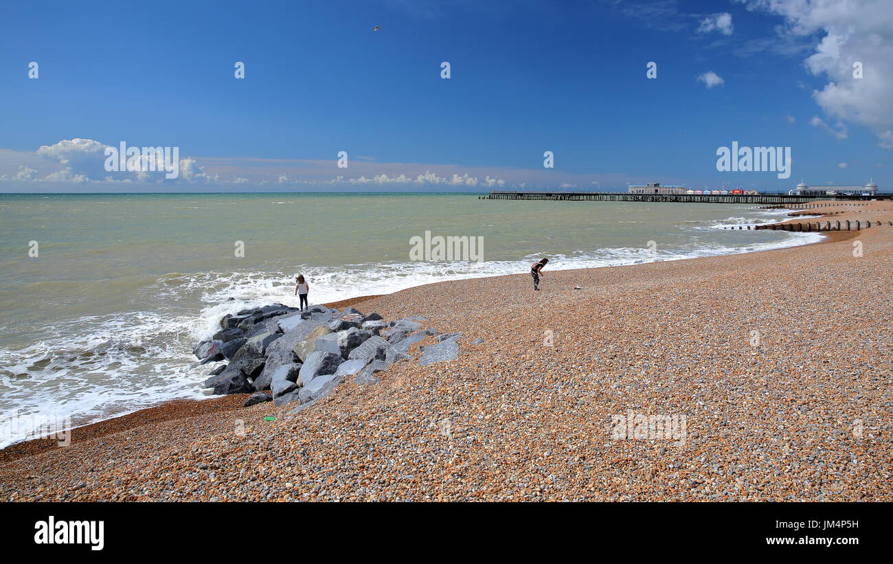 The colorful beach of Hastings with the Pier (rebuilt and open to ...