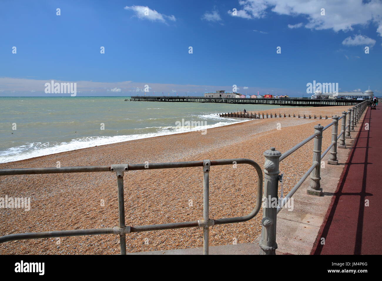 The colorful beach of Hastings with the Pier (rebuilt and open to ...