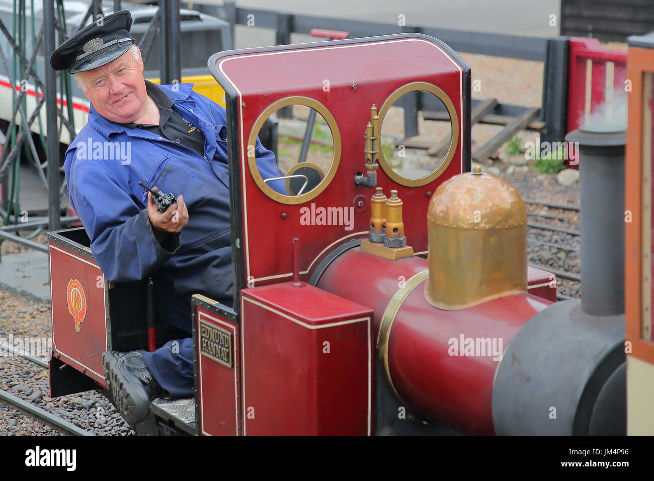 HASTINGS, UK - JULY 23, 2017: Close-up on the driver of a steam train ...