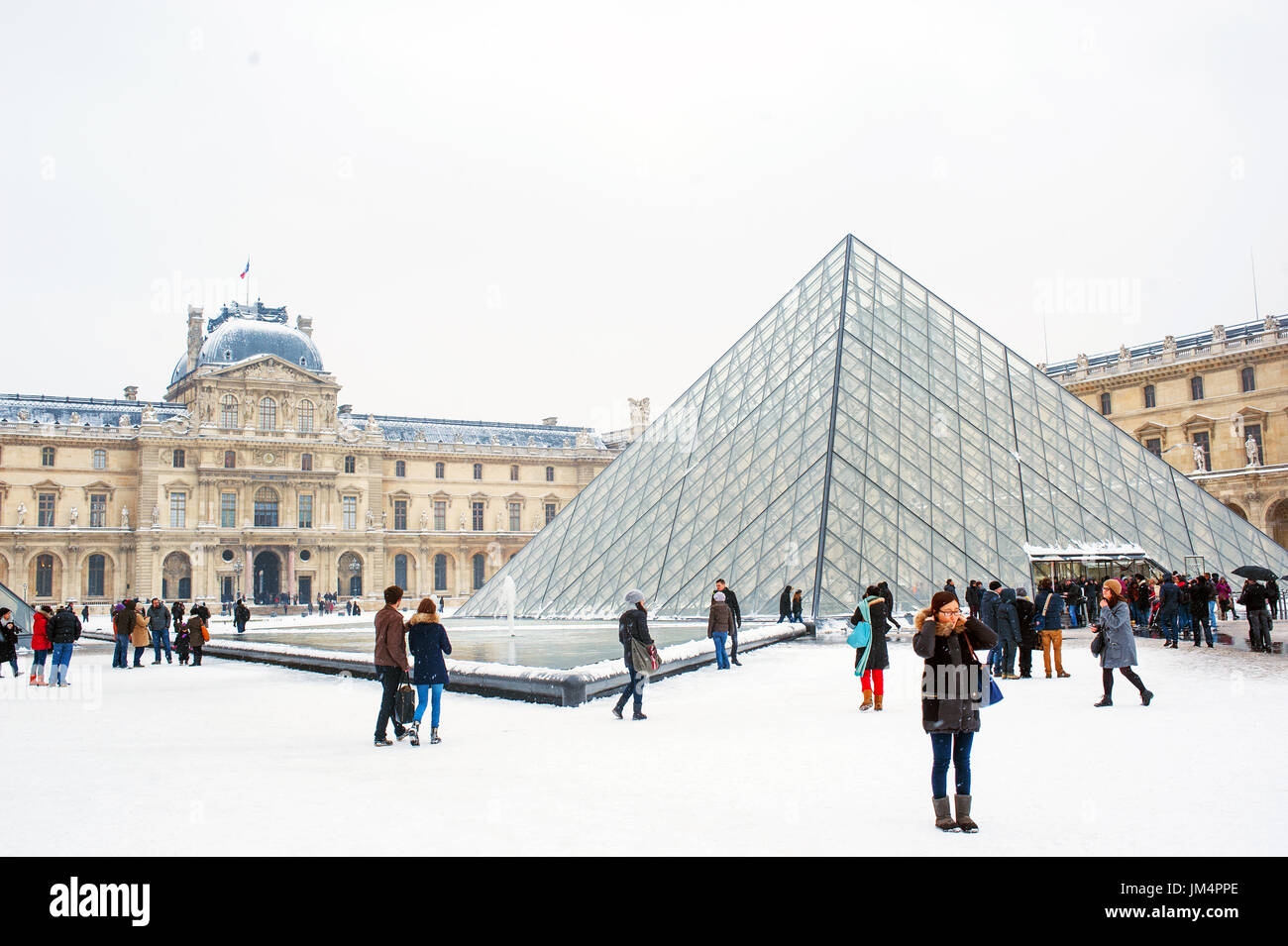Paris, France - Snow at Louvre Museum Stock Photo - Alamy