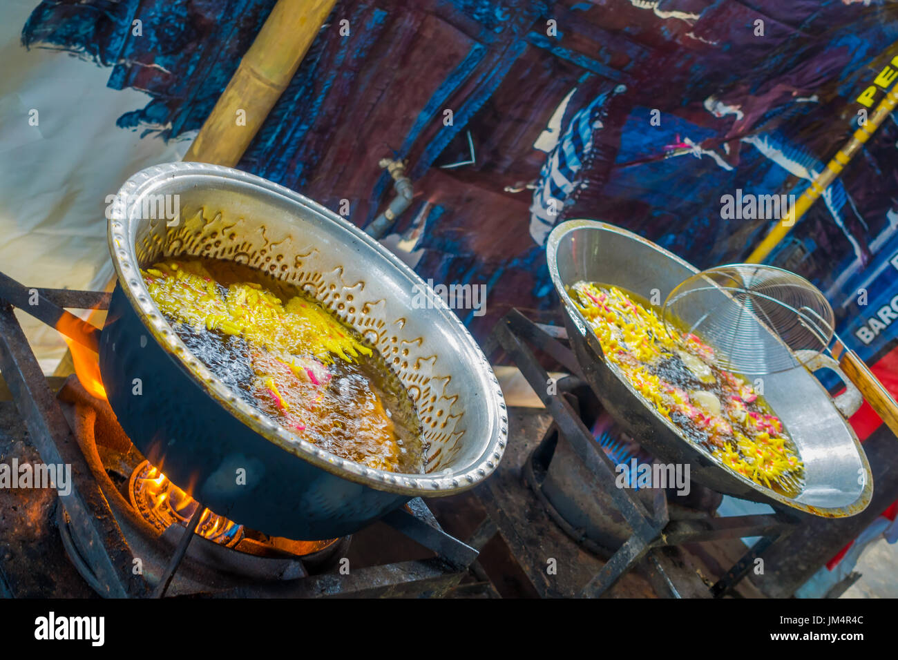 BALI, INDONESIA - MARCH 08, 2017: Cooking on a frying pan a dough for ...