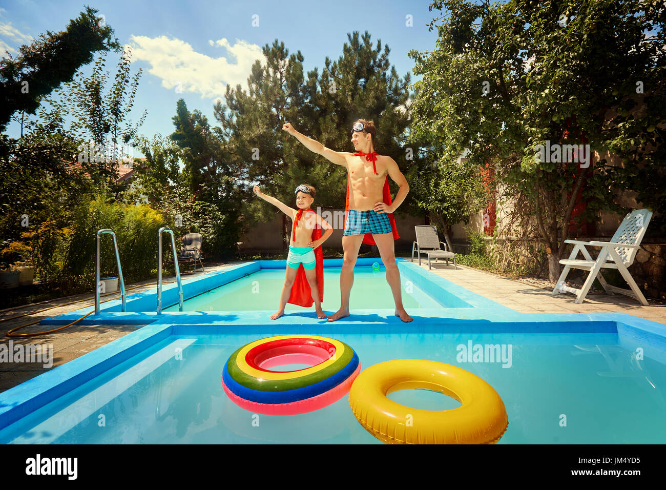 Father and son at swimming pool hi-res stock photography and images - Alamy