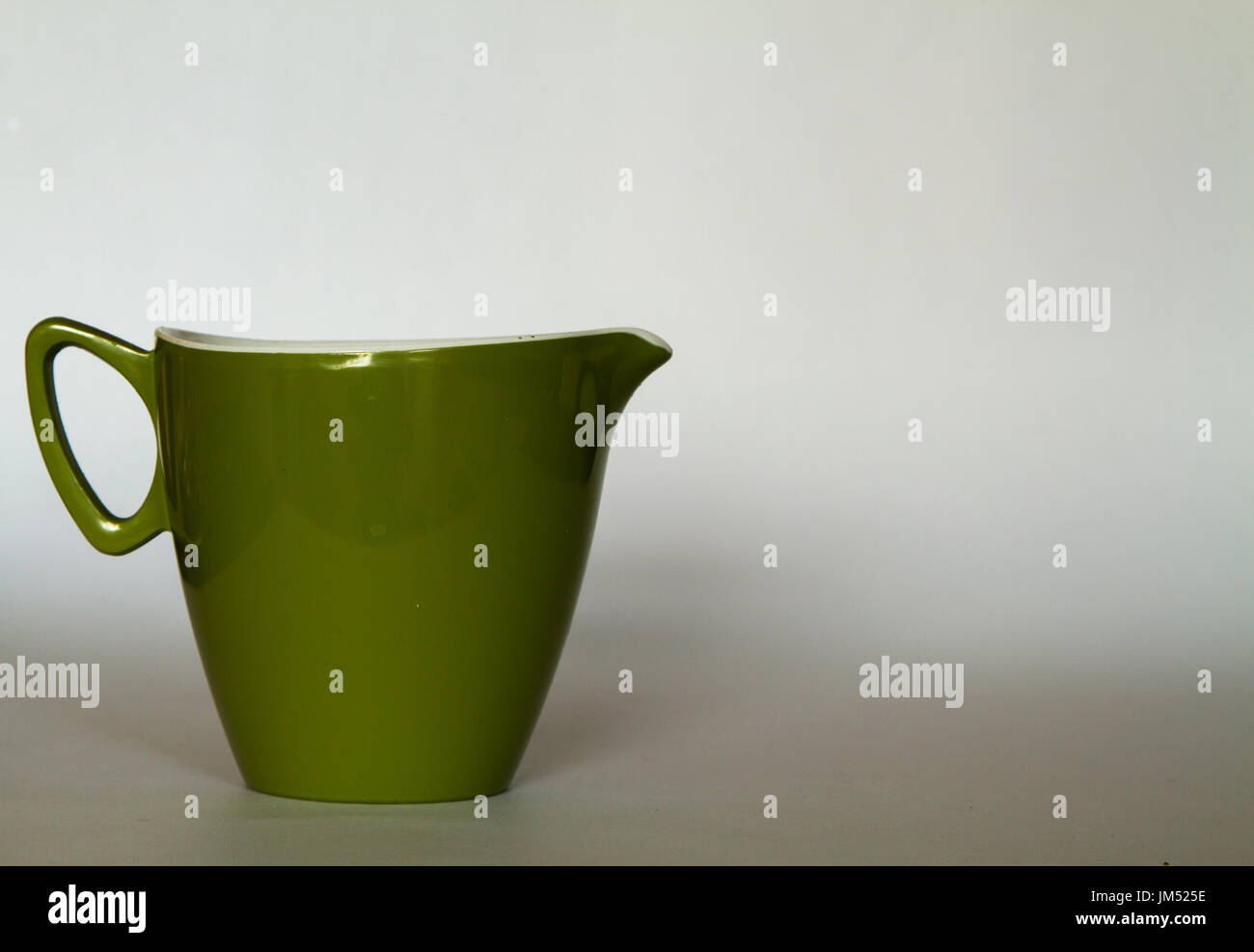 Retro Green Kitchen Jug on a White Background Stock Photo - Alamy