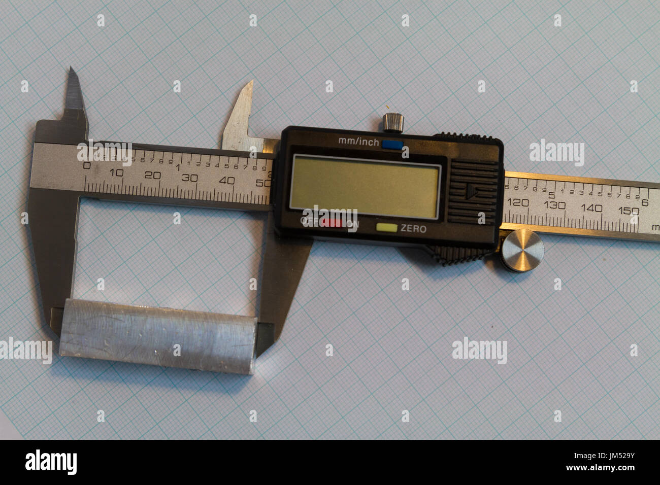Vernier Caliper measuring a block of aluminium Stock Photo - Alamy