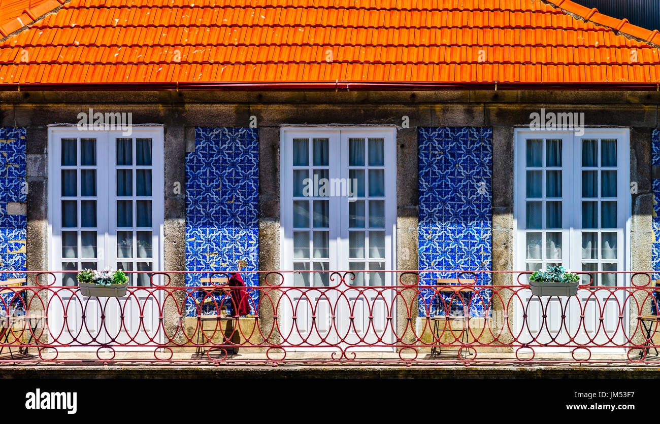 Colorful decorated facades of traditional portugal street, sunny and ...