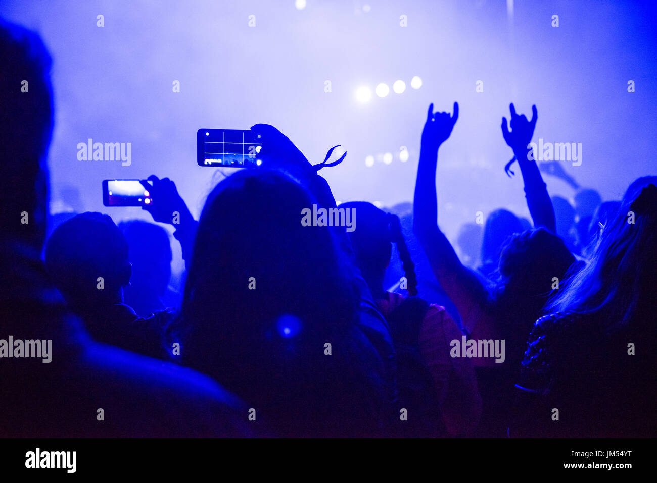 Silhouette of hands recording a concert with smart phones. Crowd of ...