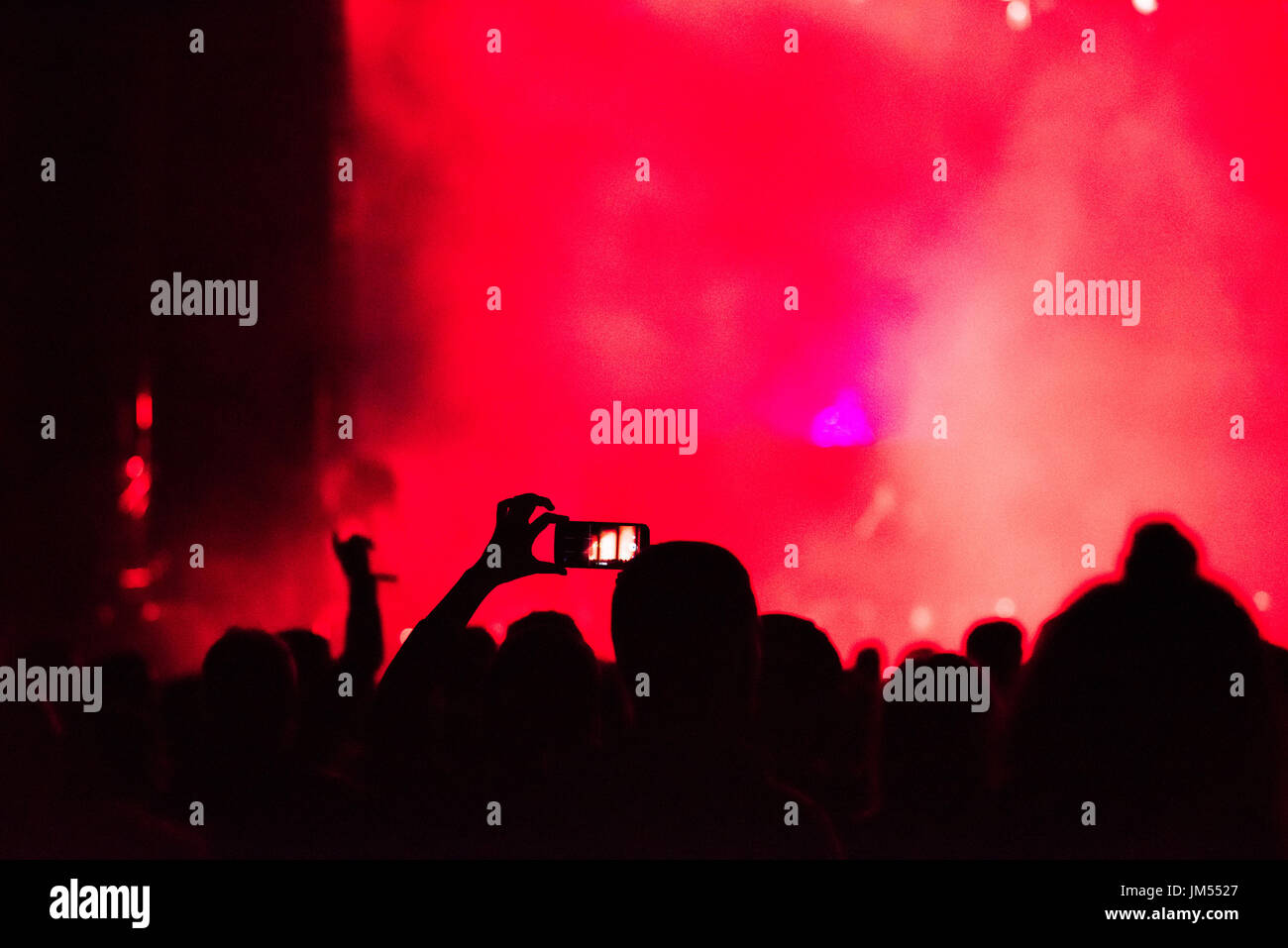 Silhouette of hands recording a concert with smart phones. Crowd of ...