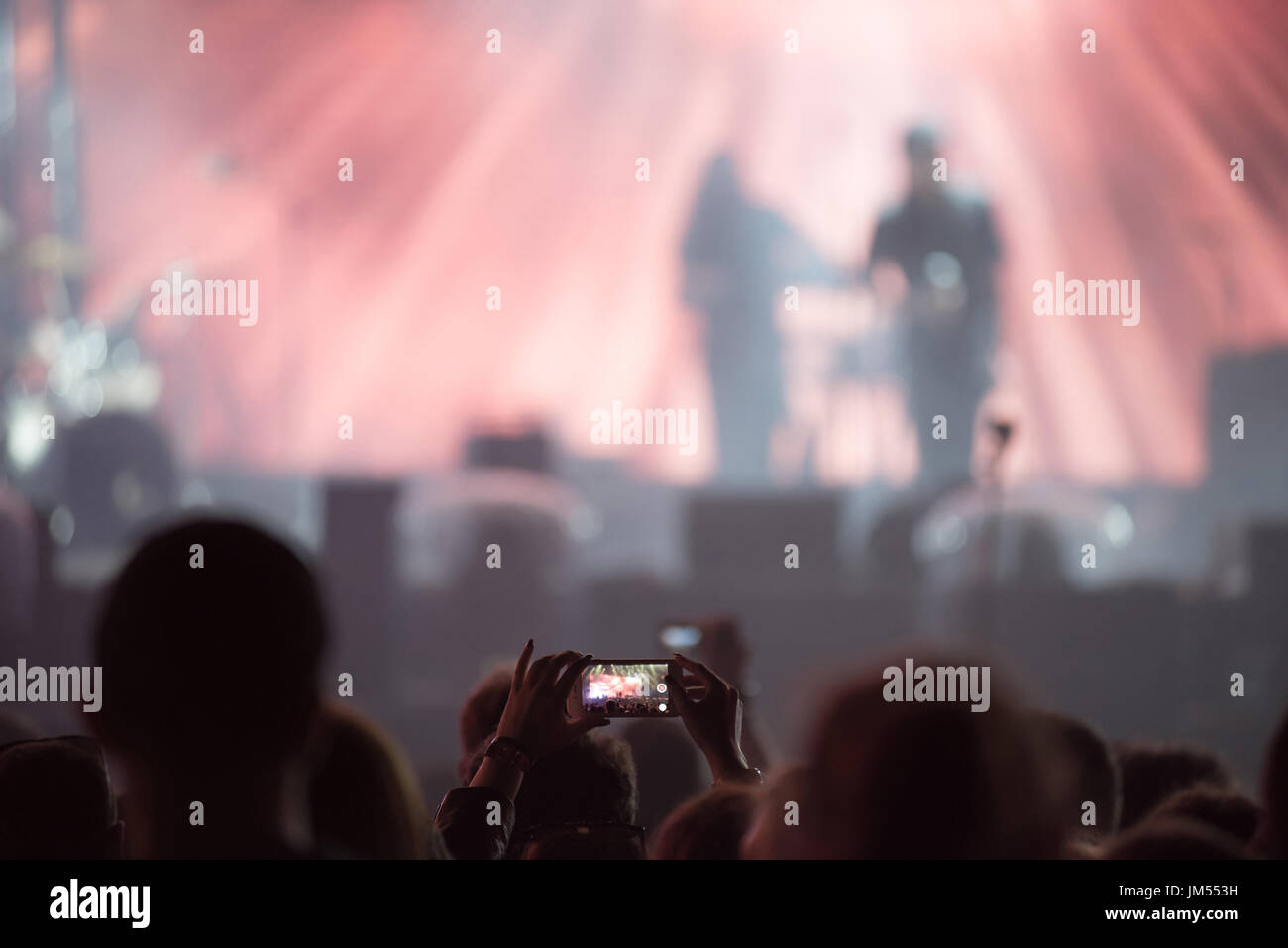 Silhouette of hands recording a concert with smart phones. Crowd of ...