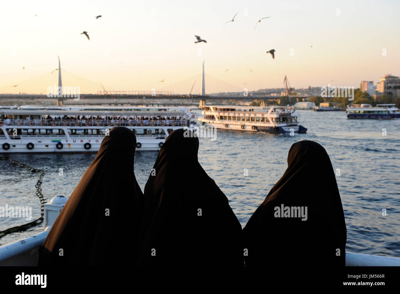 TURKEY Istanbul, veiled muslim women at Golden Horn / TUERKEI Istanbul ...